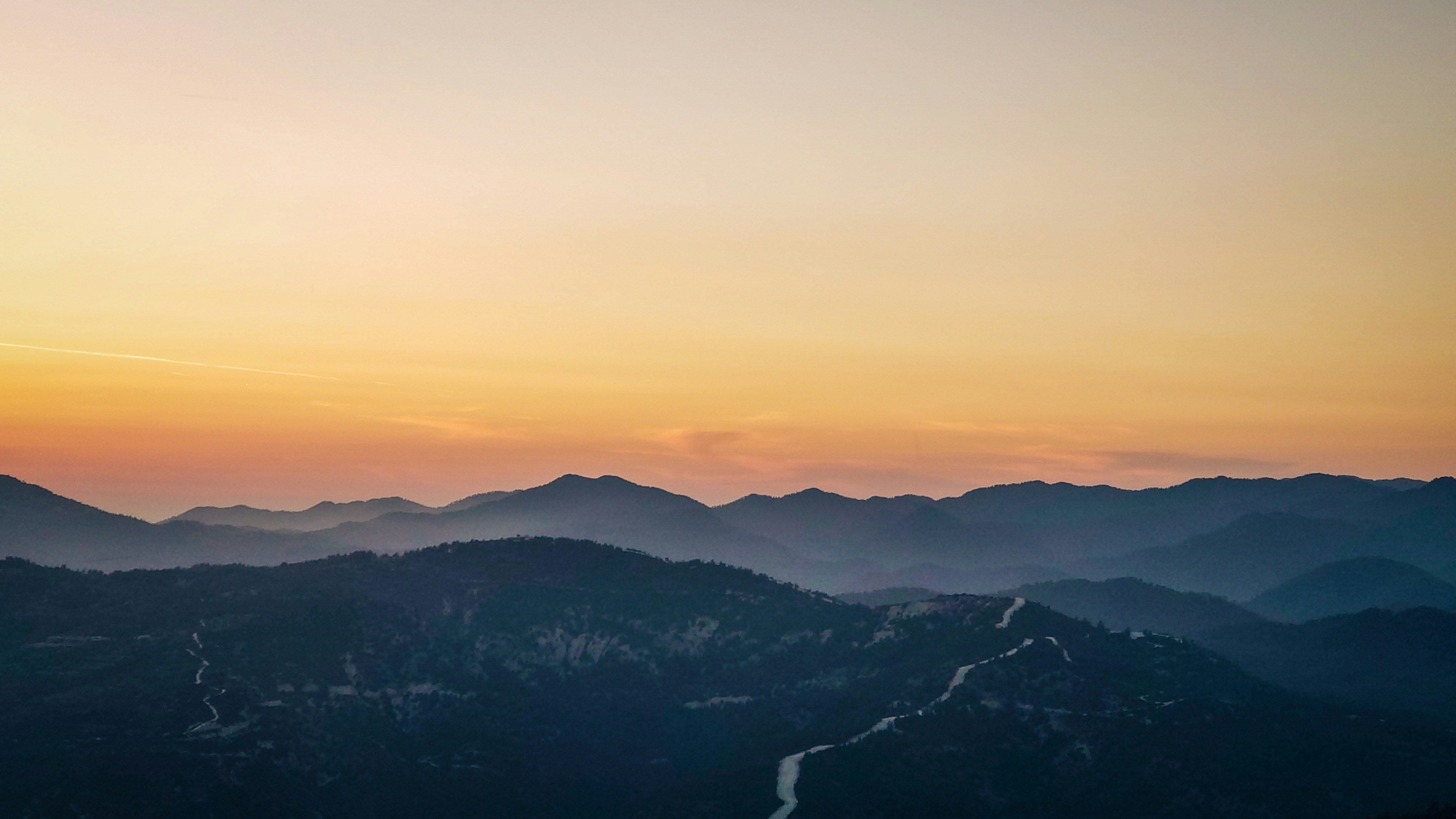 Dawn Over Quiet Ridges: A Layered Mountain Sunrise