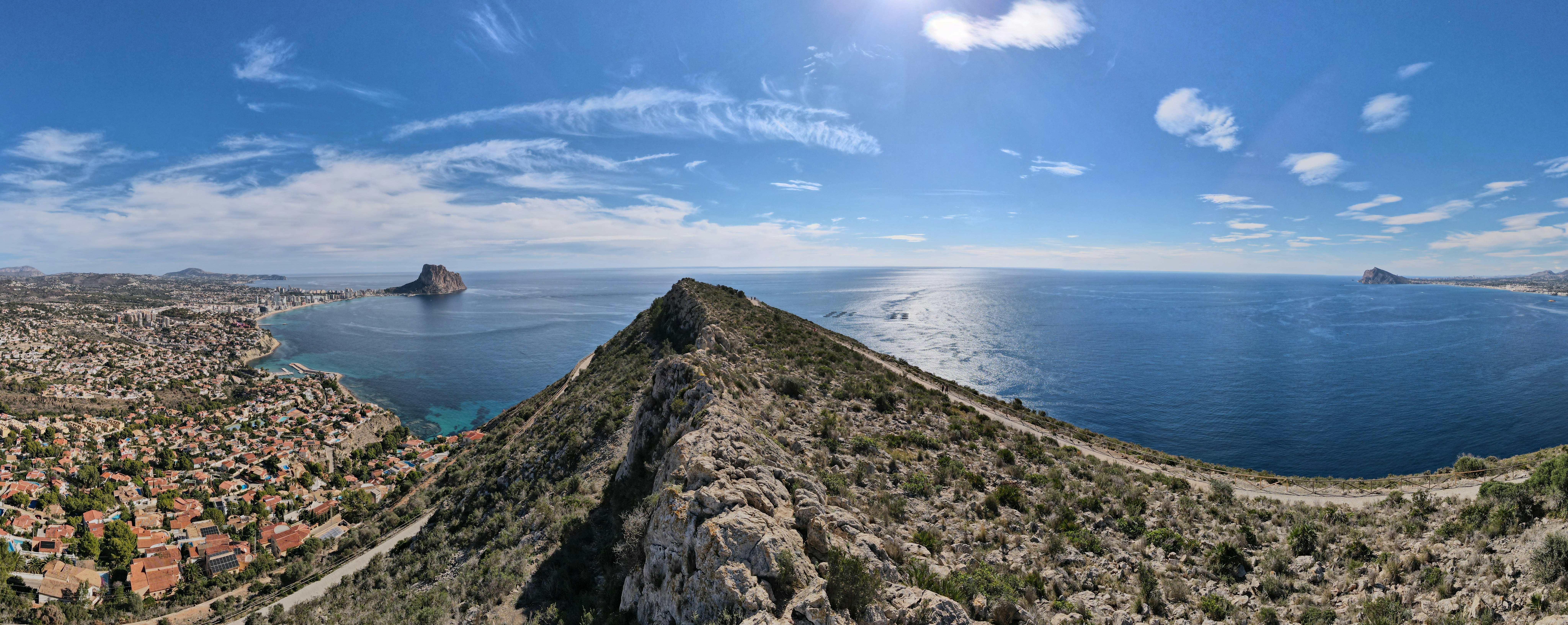 Coastal Panorama from the Ridge: A Sunlit Peninsula Meeting the Sea