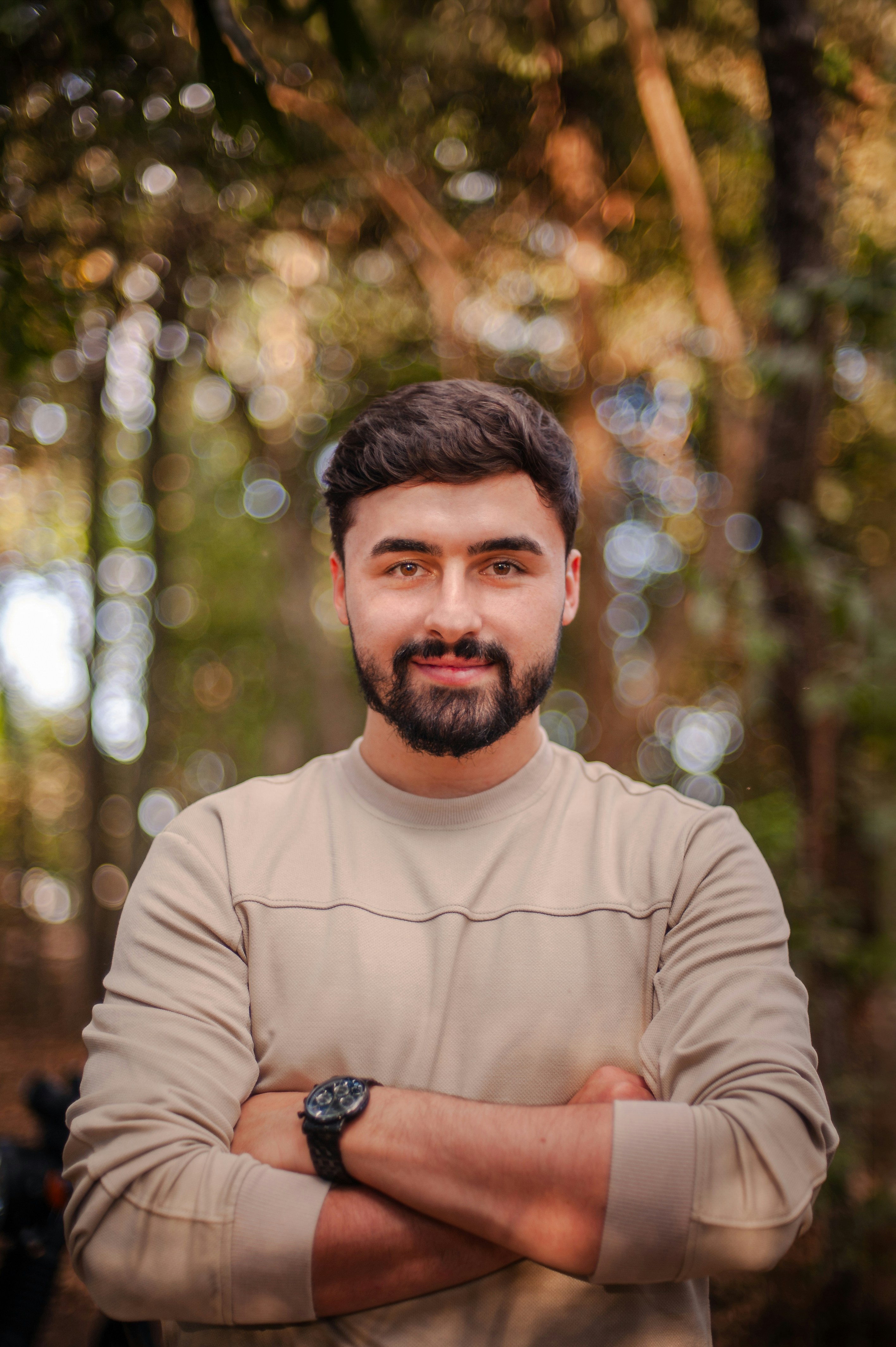 Crossed Arms, Quiet Confidence: A Portrait in the Woods
