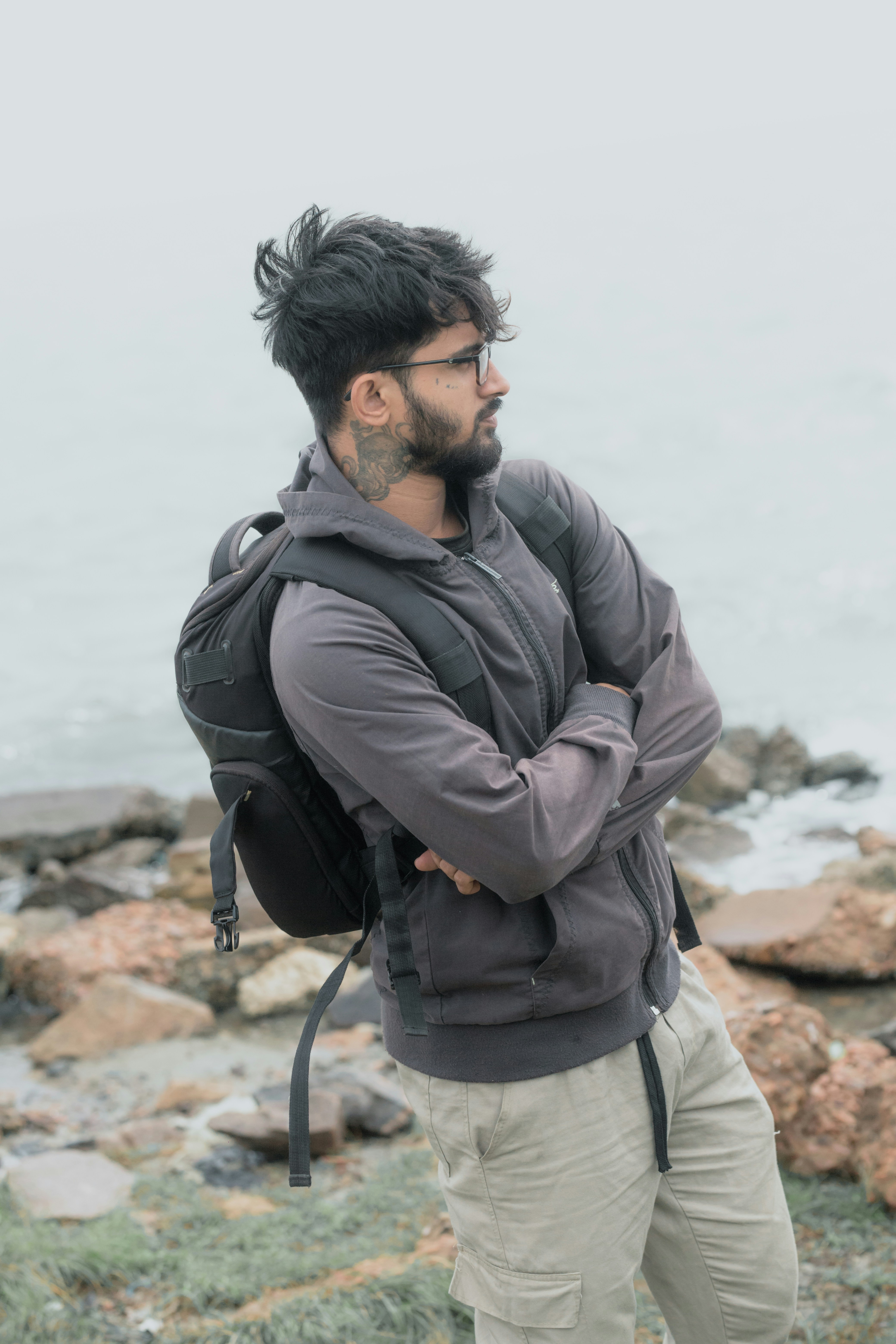 Coastal Traveler: A Quiet Stance by the Rocks