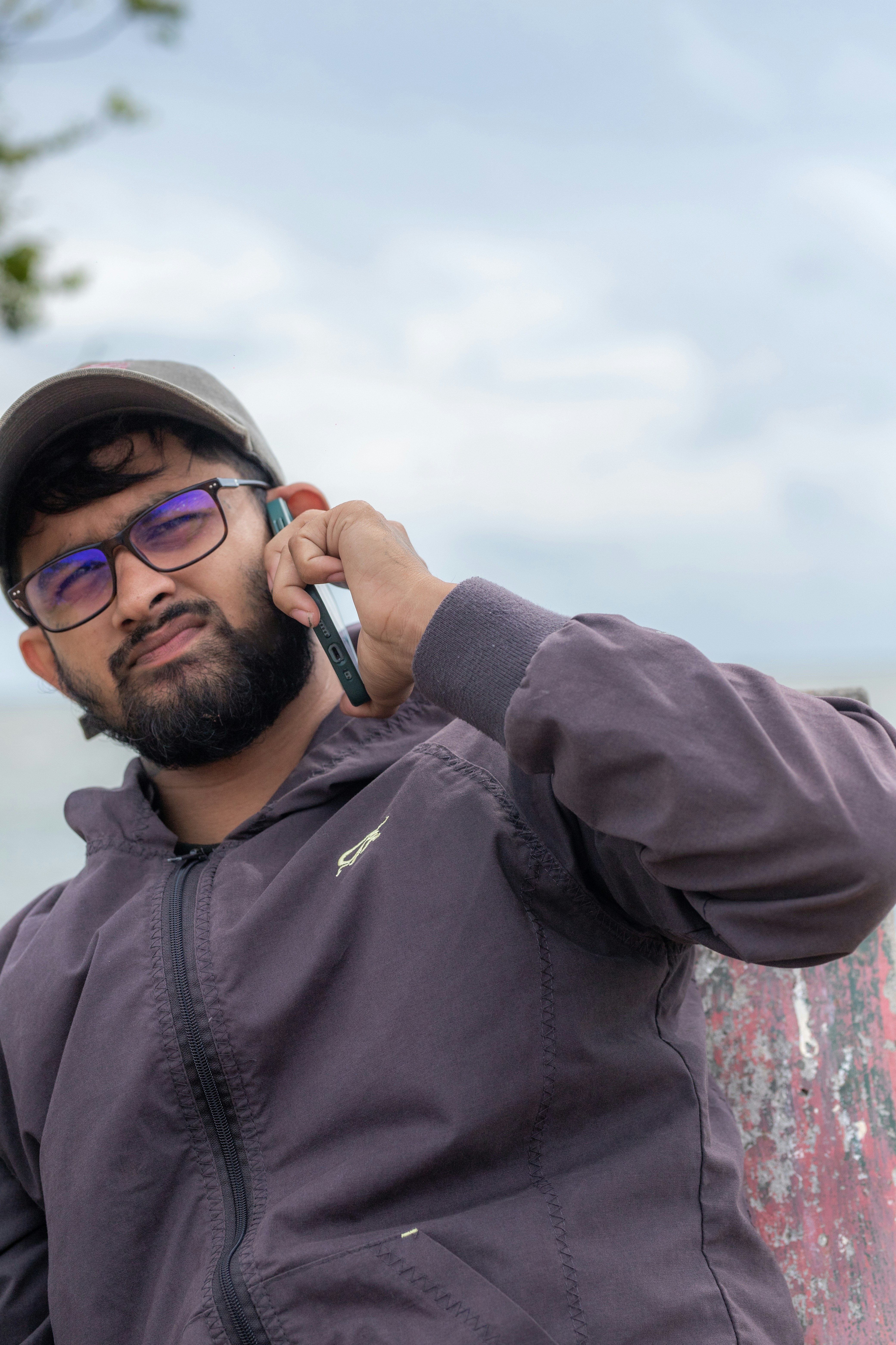 Portrait on a Seaside Break: Quiet Confidence in a Phone Conversation