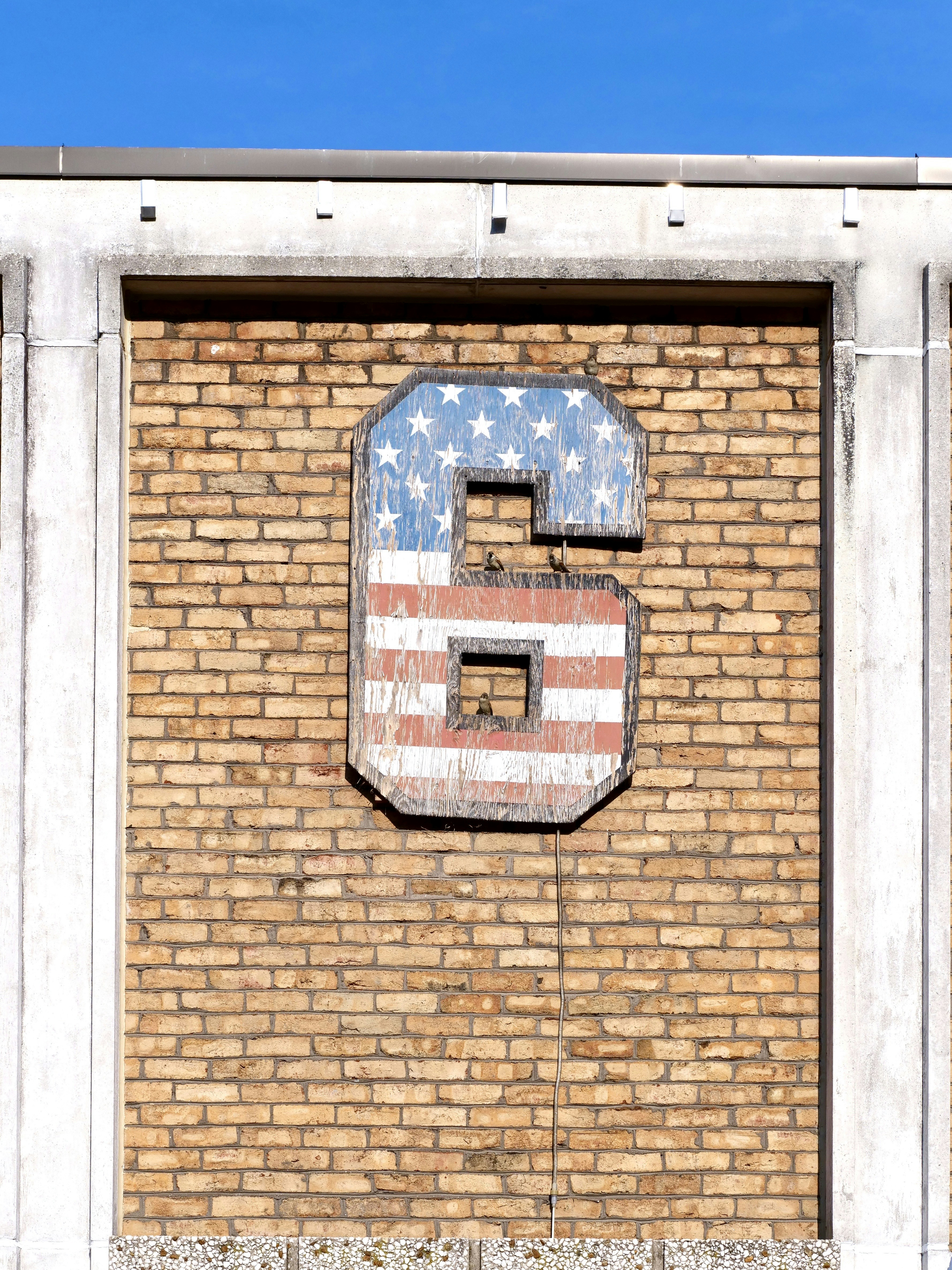 Branded Brick: An American numeral centerpiece on a weathered wall