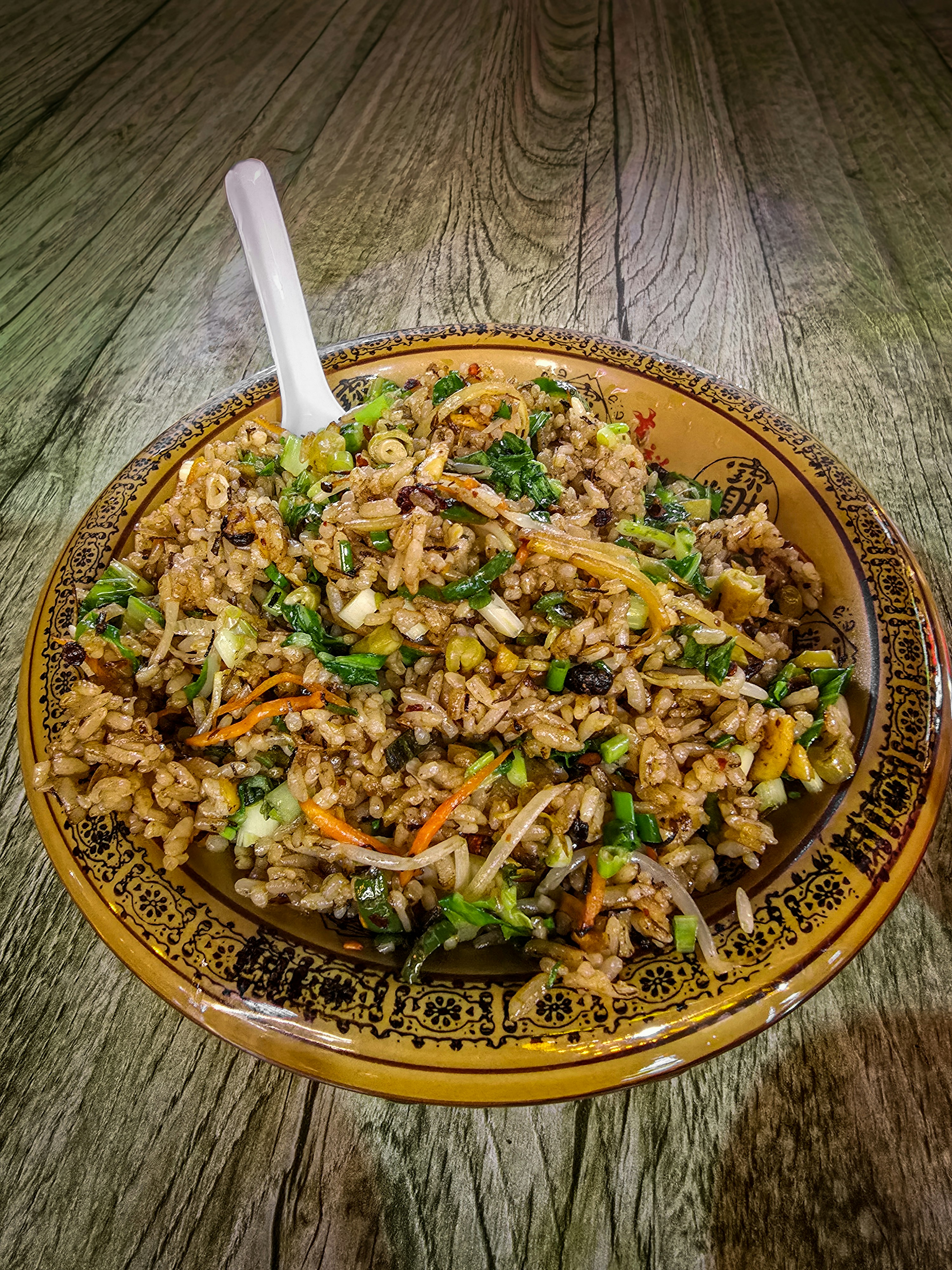 Crystallized Sesame-Fried Rice Bowl on a Rustic Table
