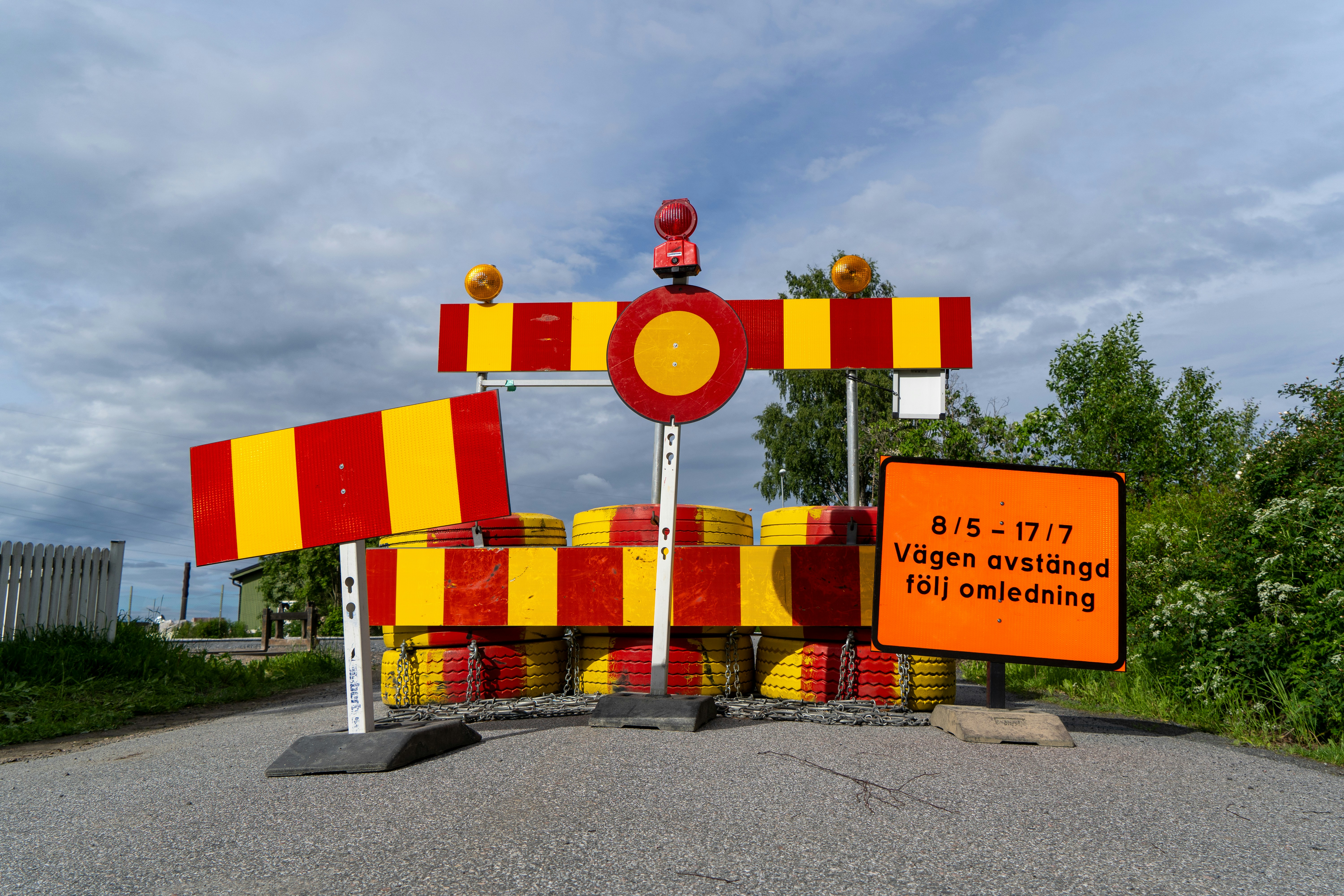 Roadblock at the Edge: A Brightly Painted Barrier Stokes the Road to Progress