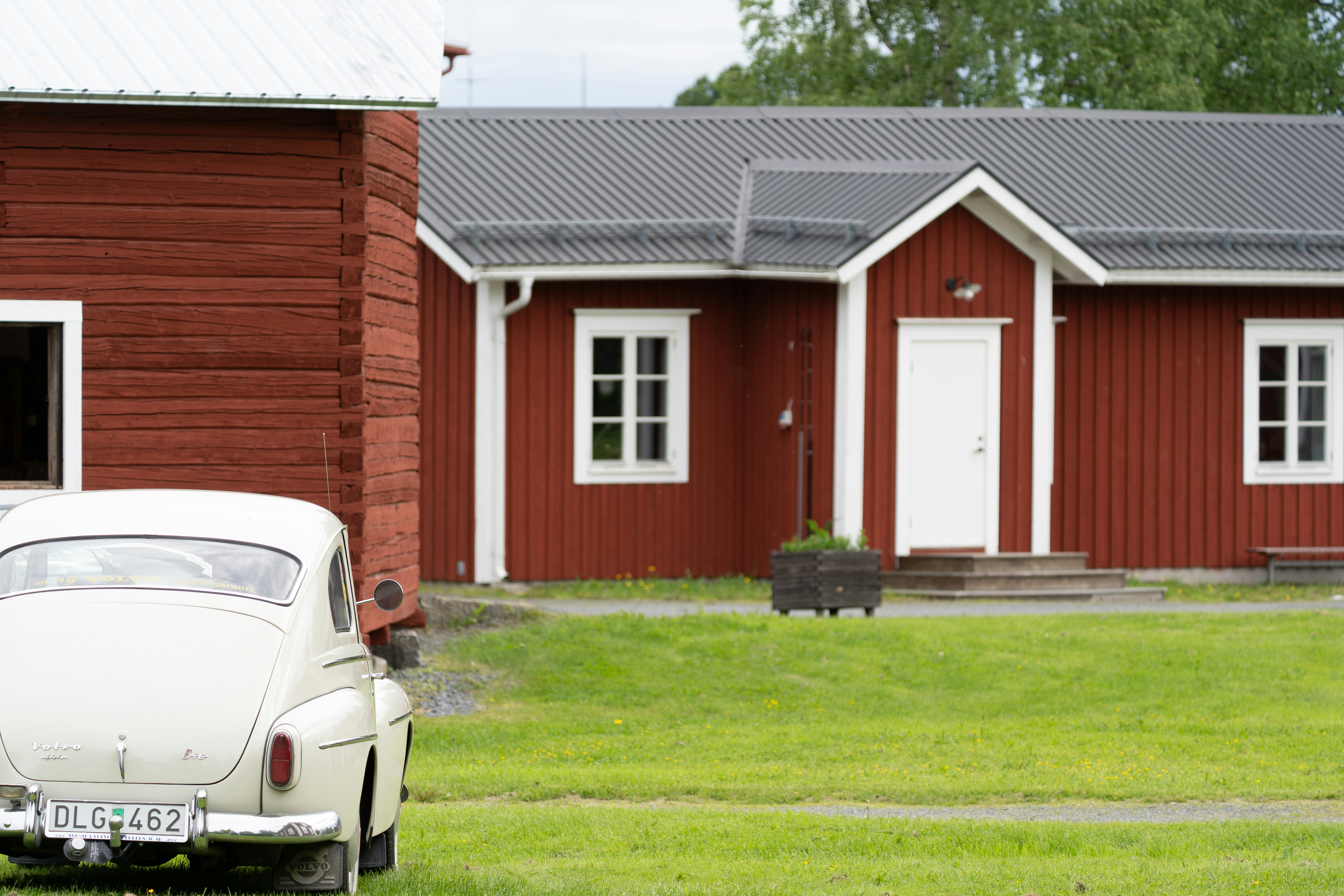 Red Barn Quietude: A Vintage Car by the Farmstead