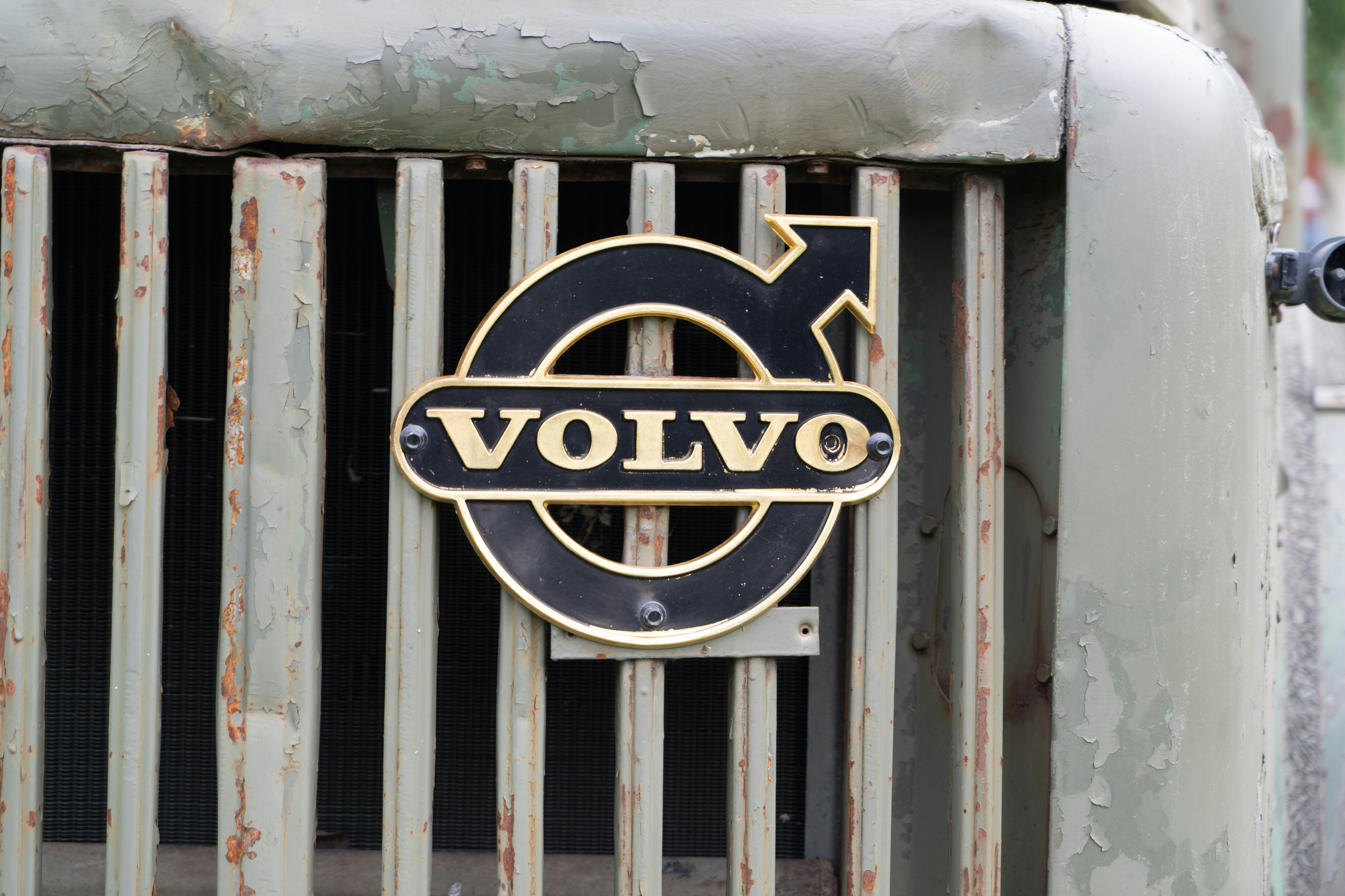 Volvo Emblem on a Weathered Front Grille