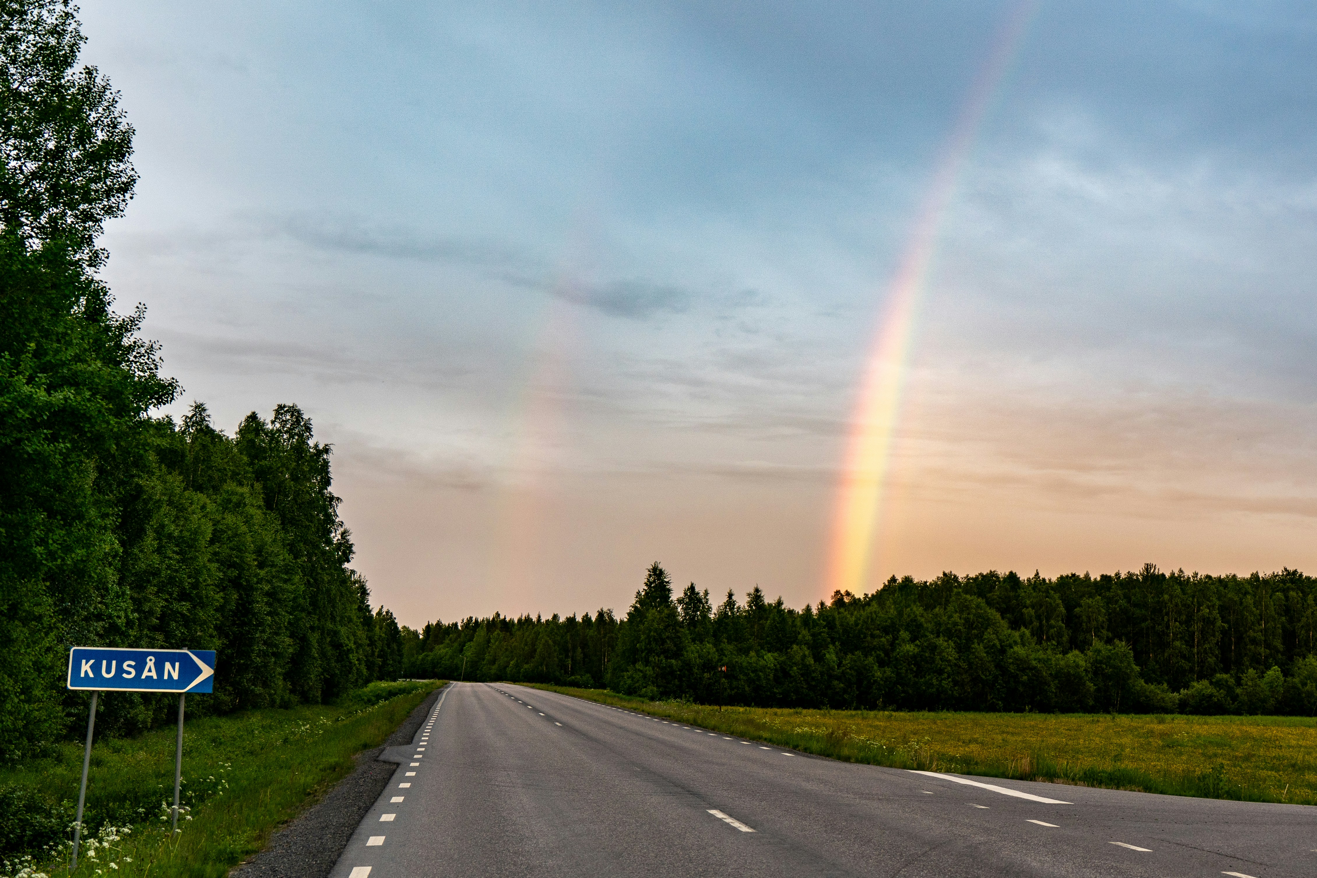Double Rainbow Over a Quiet Highway to the Forest