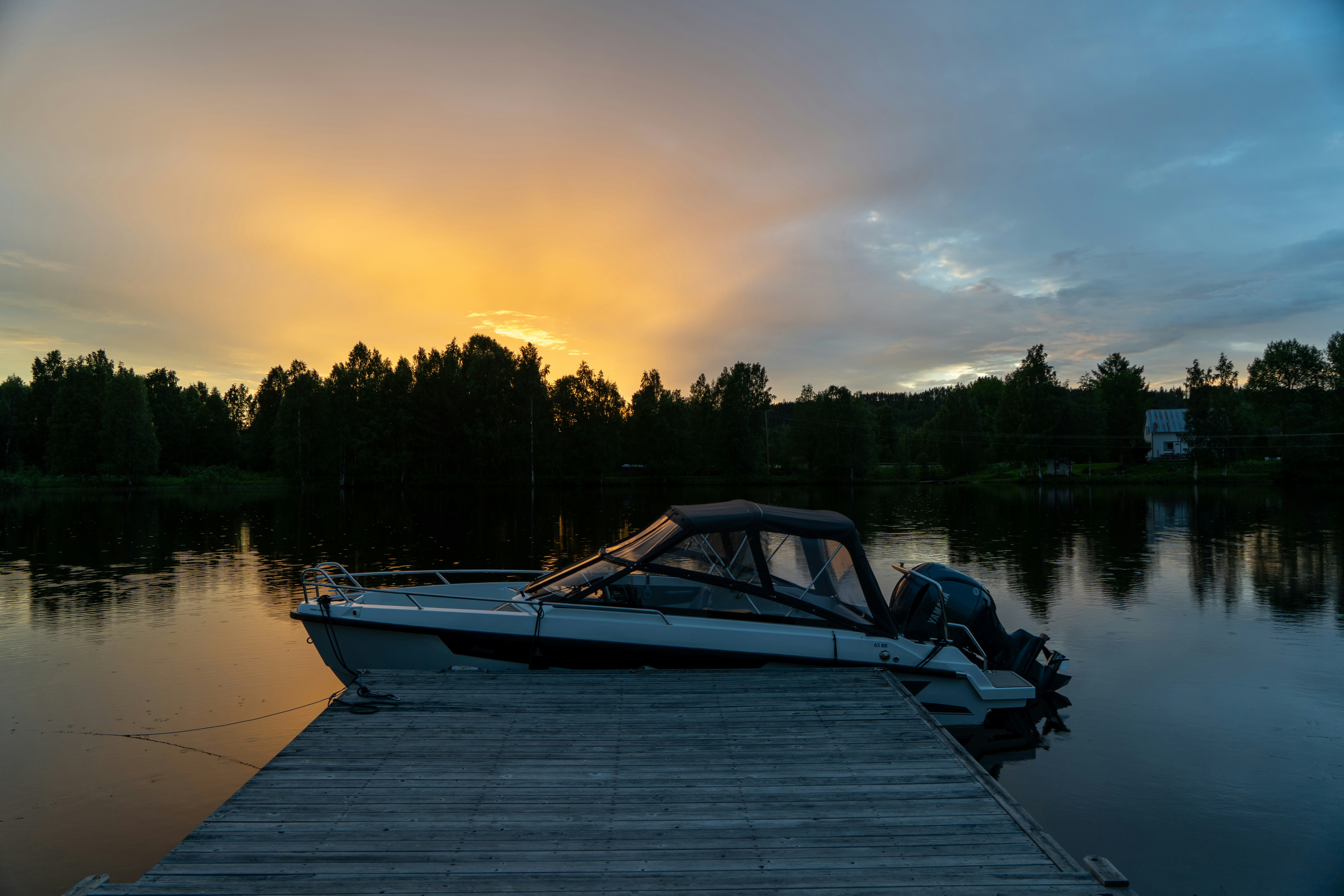 Quiet Marina at Sunset: Boat Tucked at the Dock