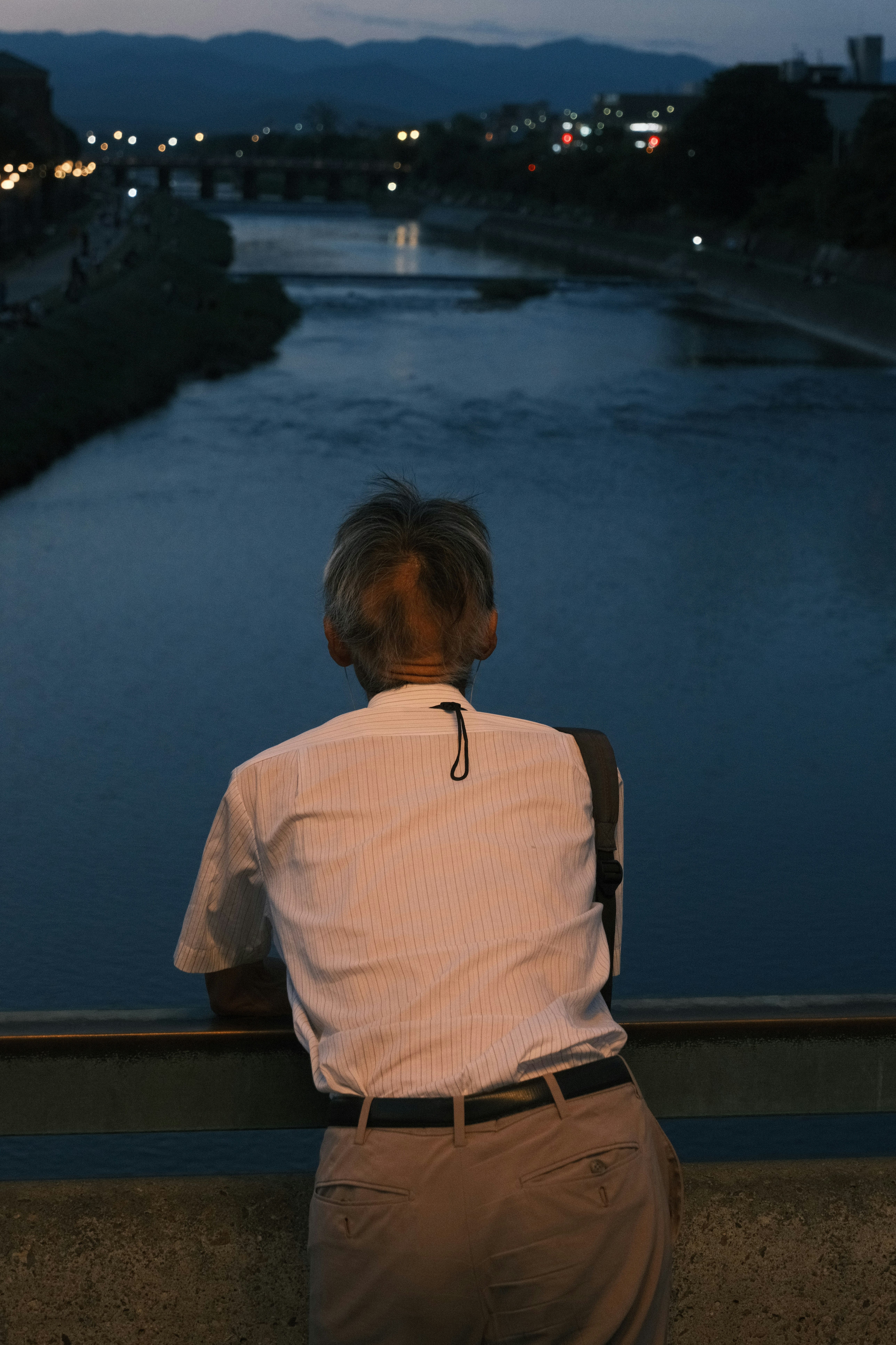 Evening by the Riverbank: A Portrait of Contemplation