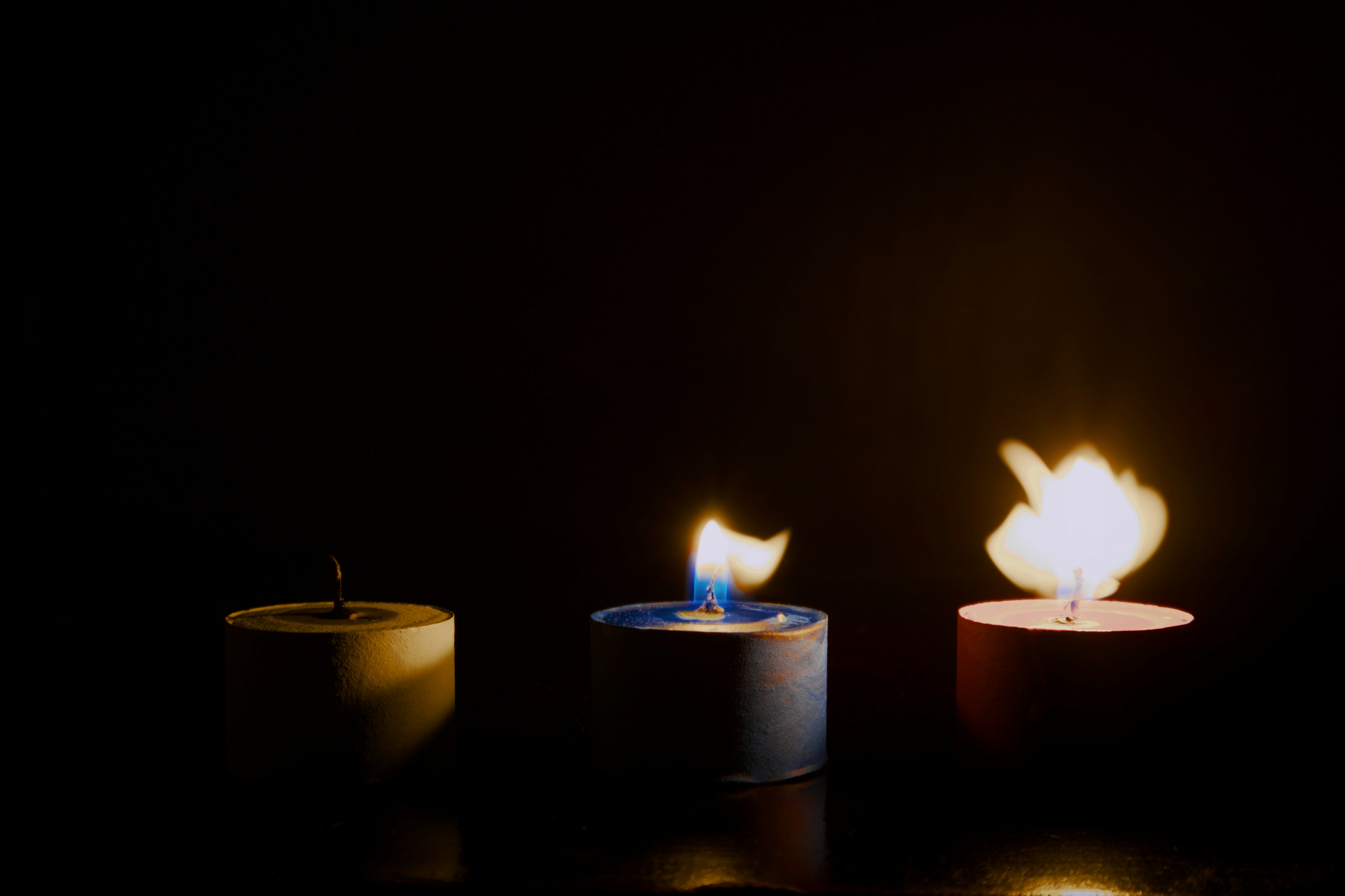 Three Flame Sentinels in a Velvet Night