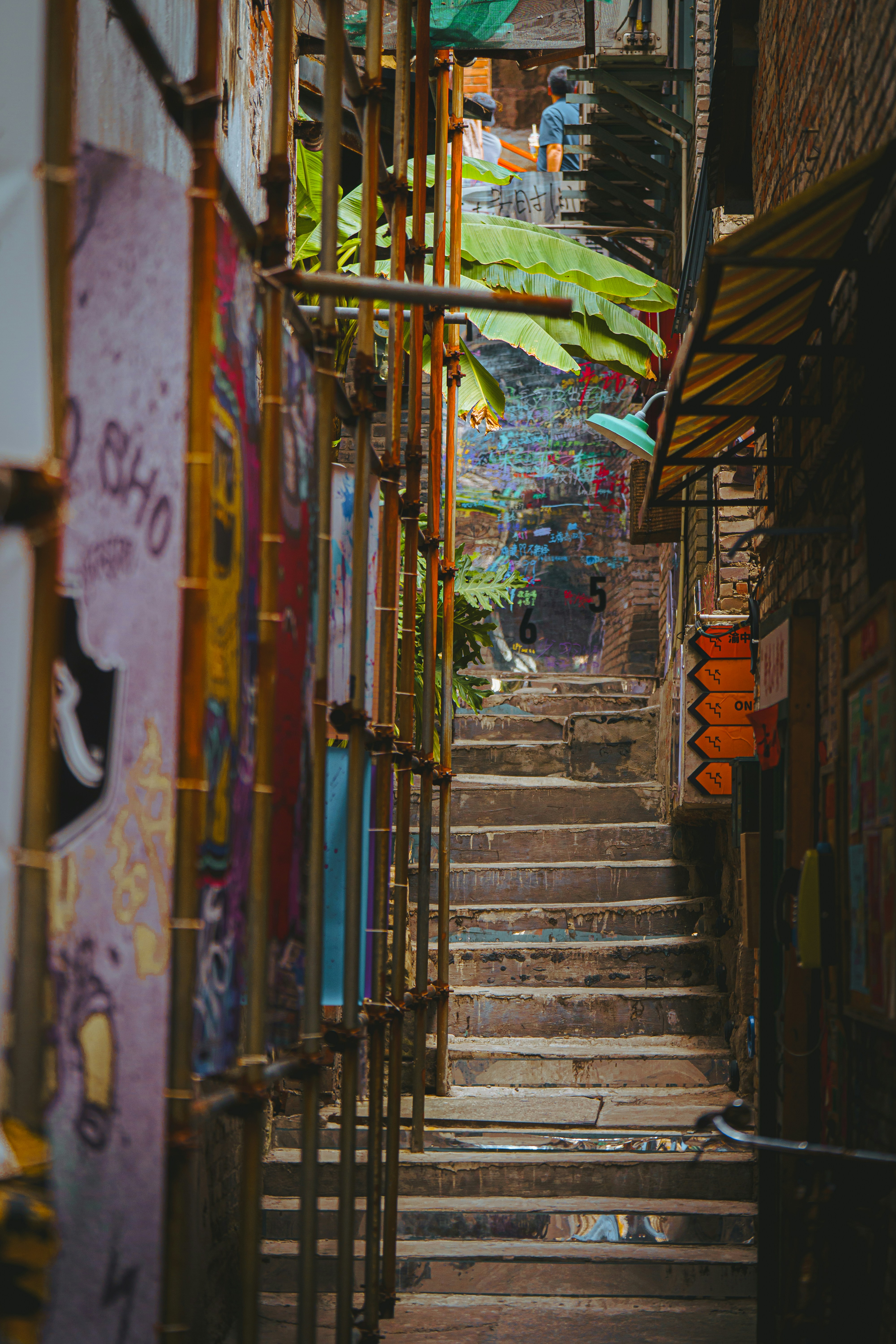 Sunlit Staircase Through a Graffiti Alley