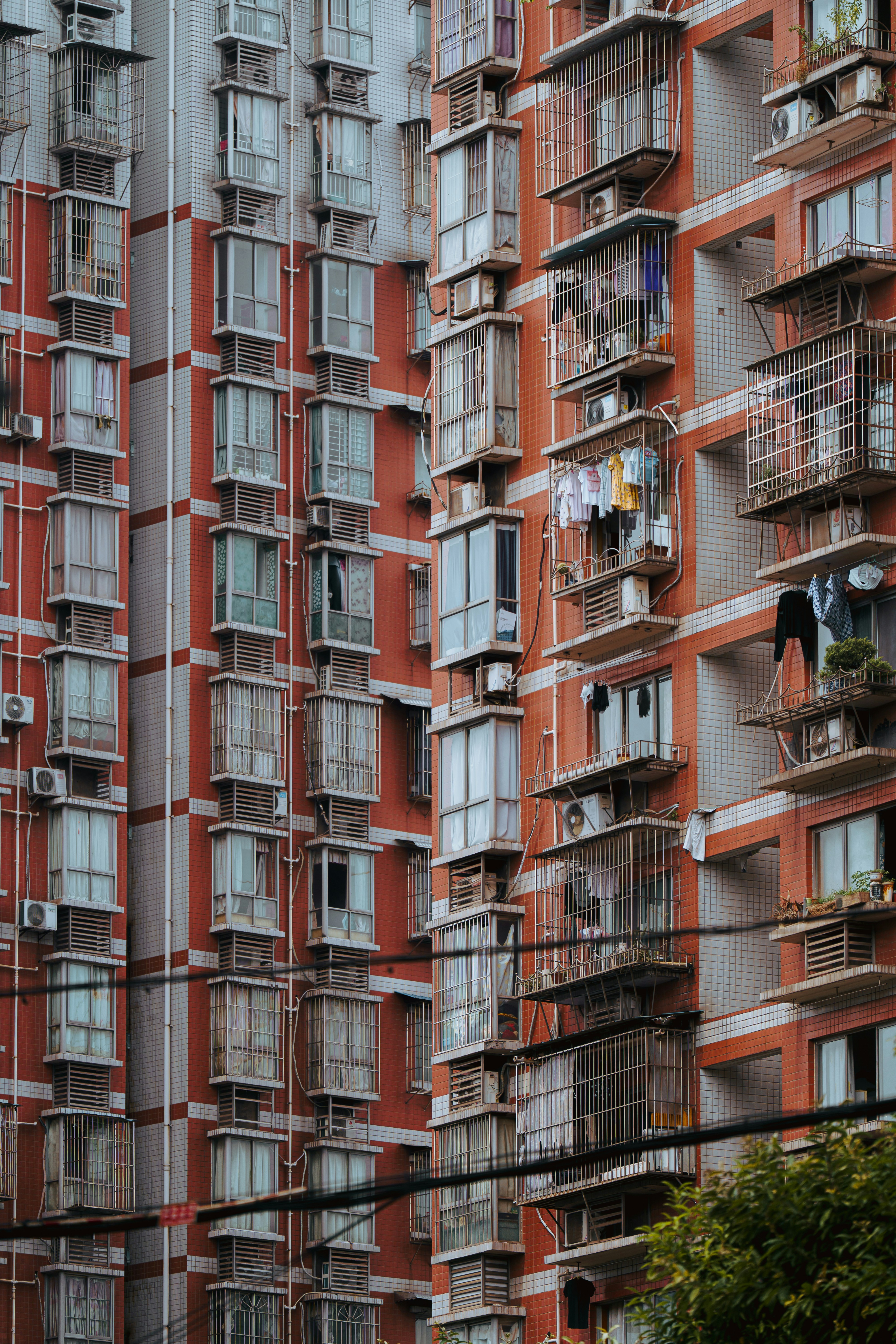 Red-Brick Skywalk: a vertical grid of balconies and laundry