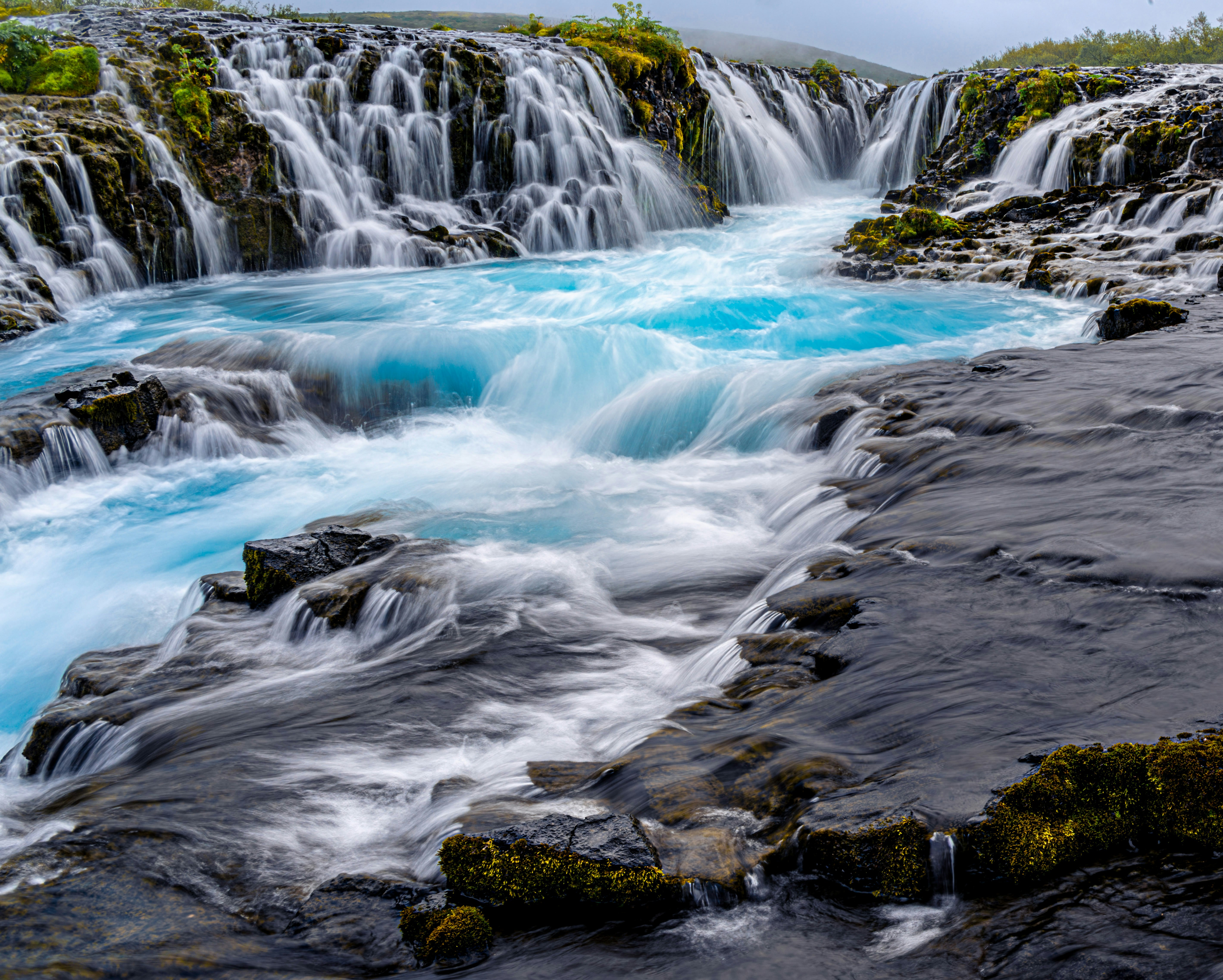 Icy Veins over Basalt: a Blue Cascade's Quiet Power