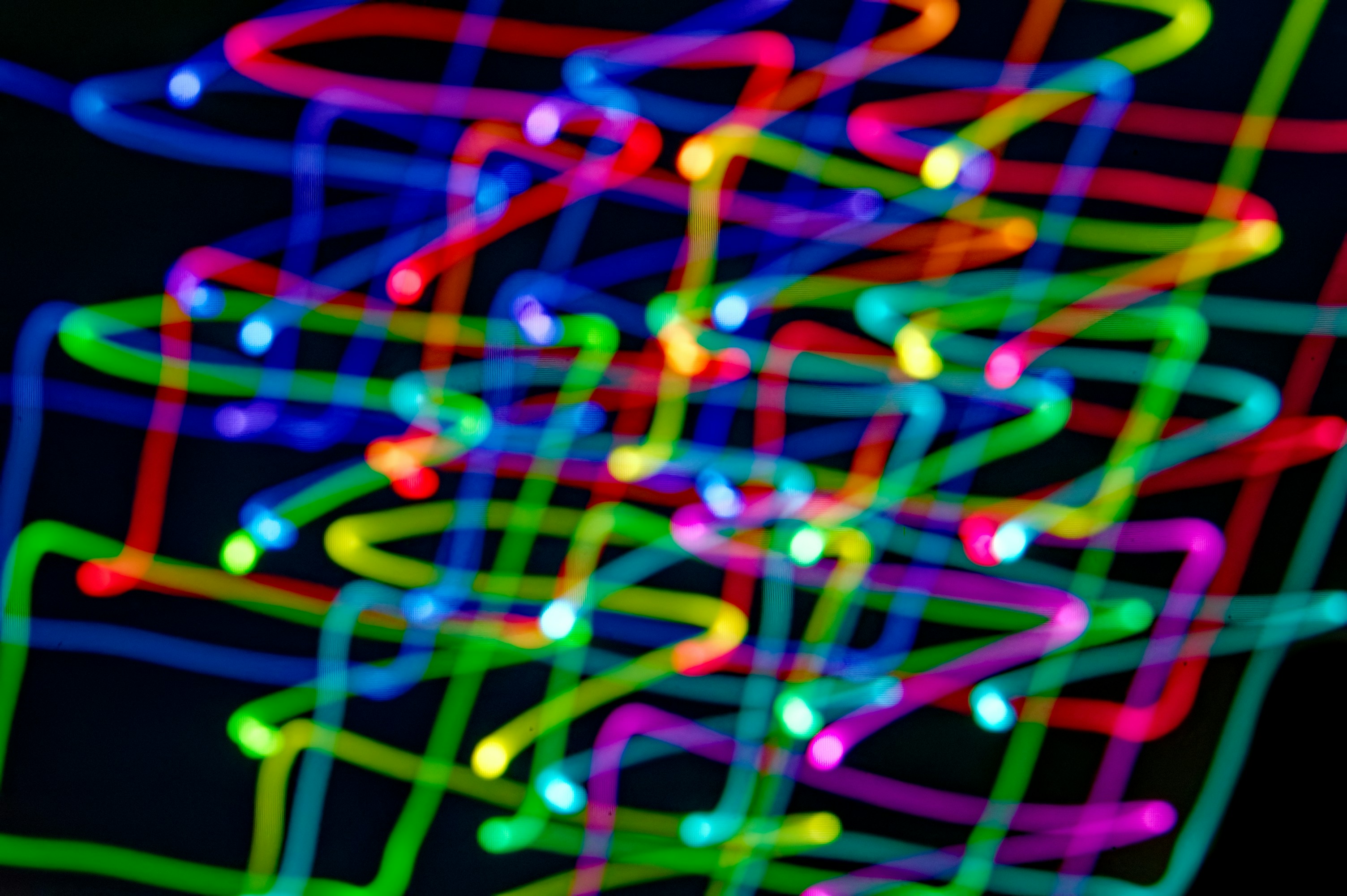 Luminous Cadence: Neon Light Trails in a Dark Studio