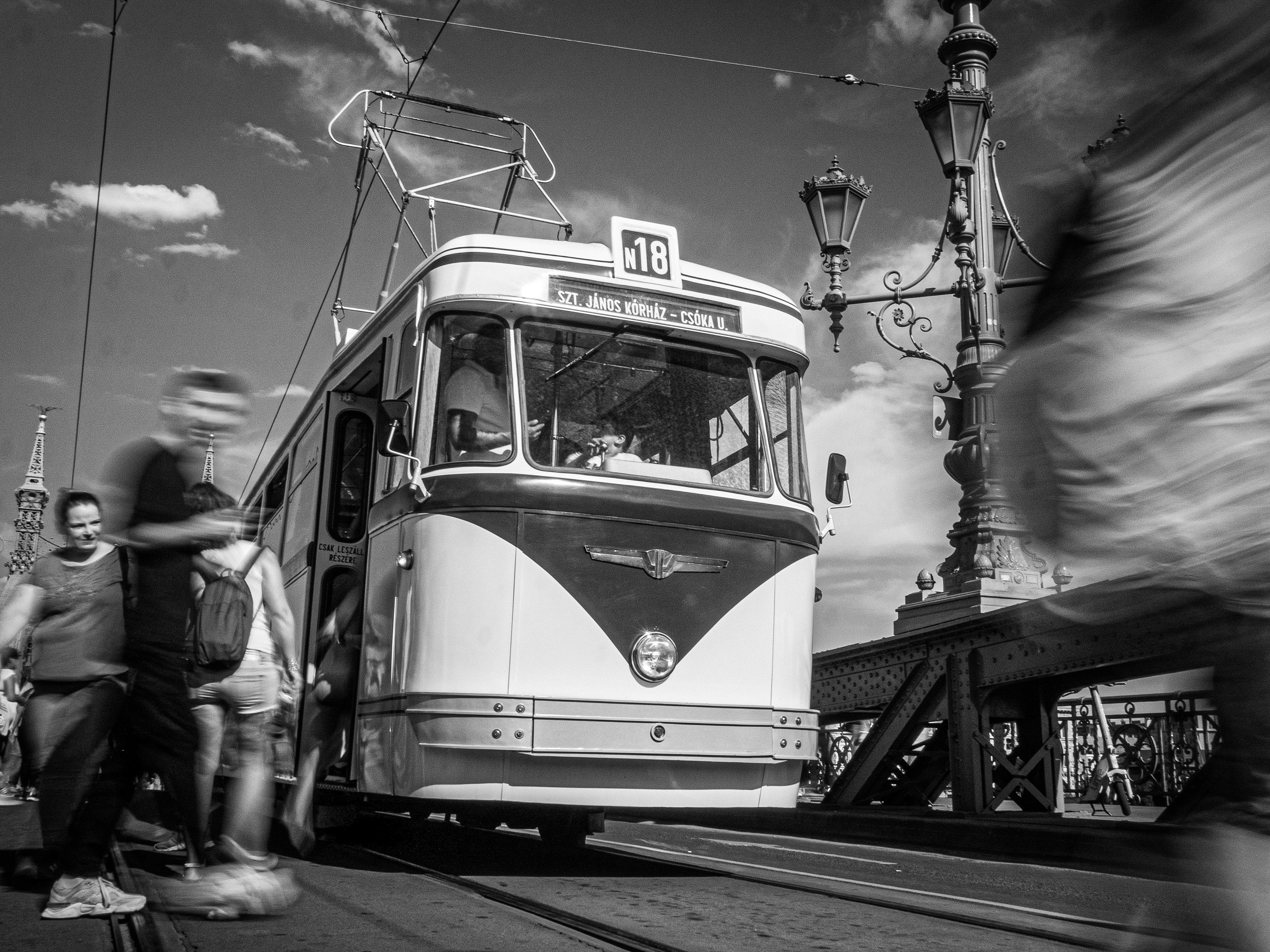 Railway in Motion: A Nostalgic Streetcar Crossing the Bridge