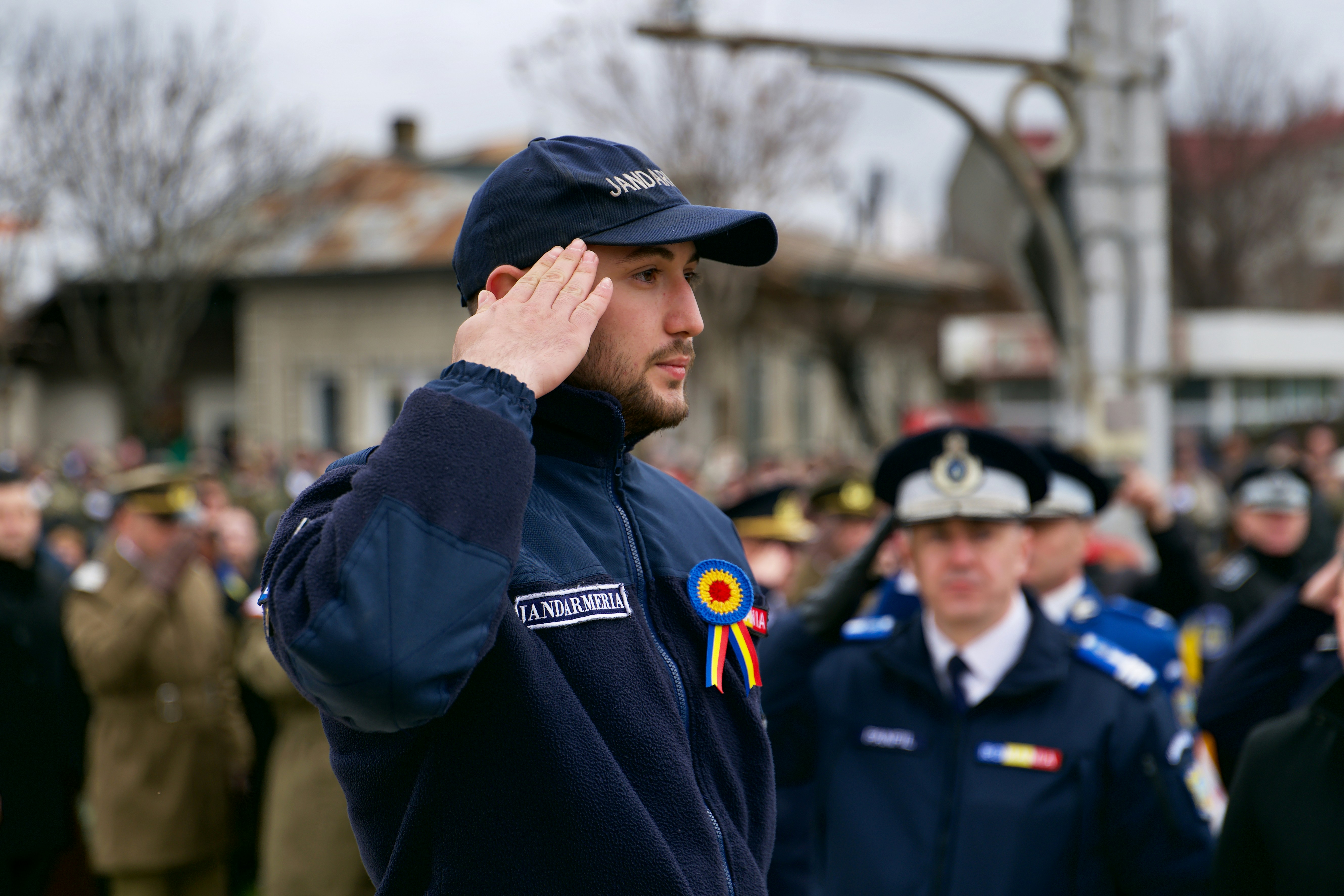 Saluting in the Parade: A Quiet Moment Amidst Ceremony