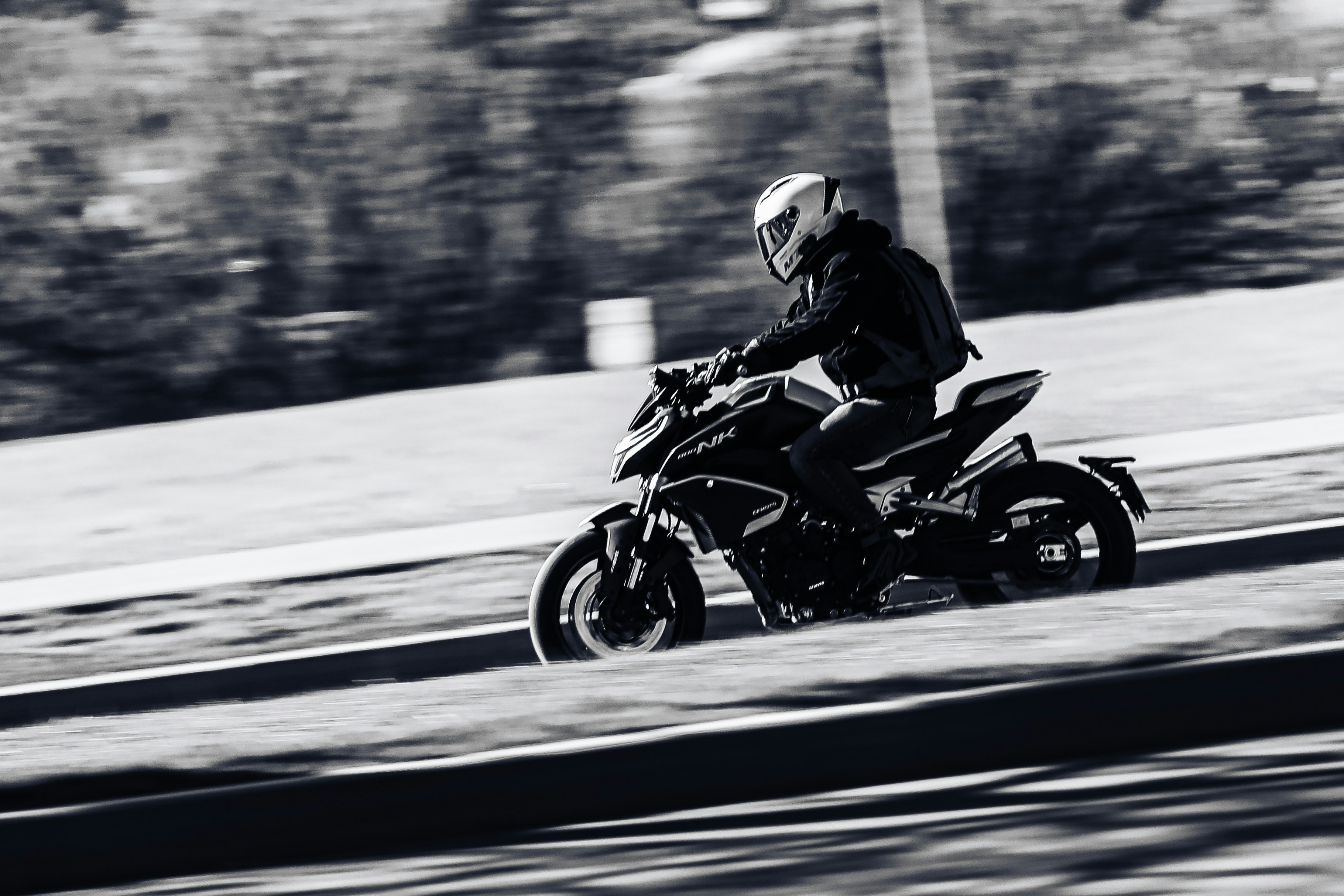 Rider in Motion: A Black-and-White Blur of Speed