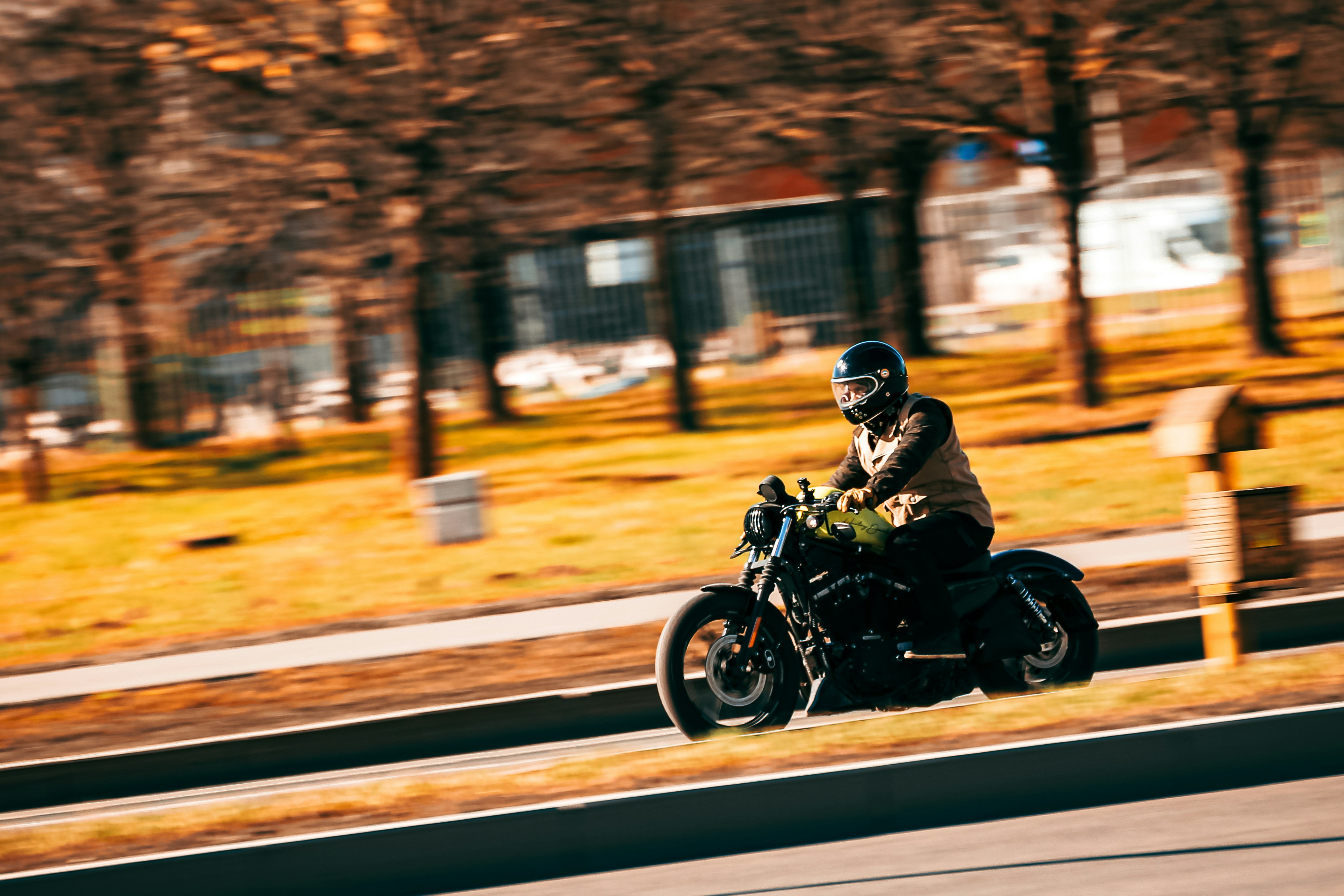 Rider on a Sunset-tinged Ride: A Street-Borne Moto Moment