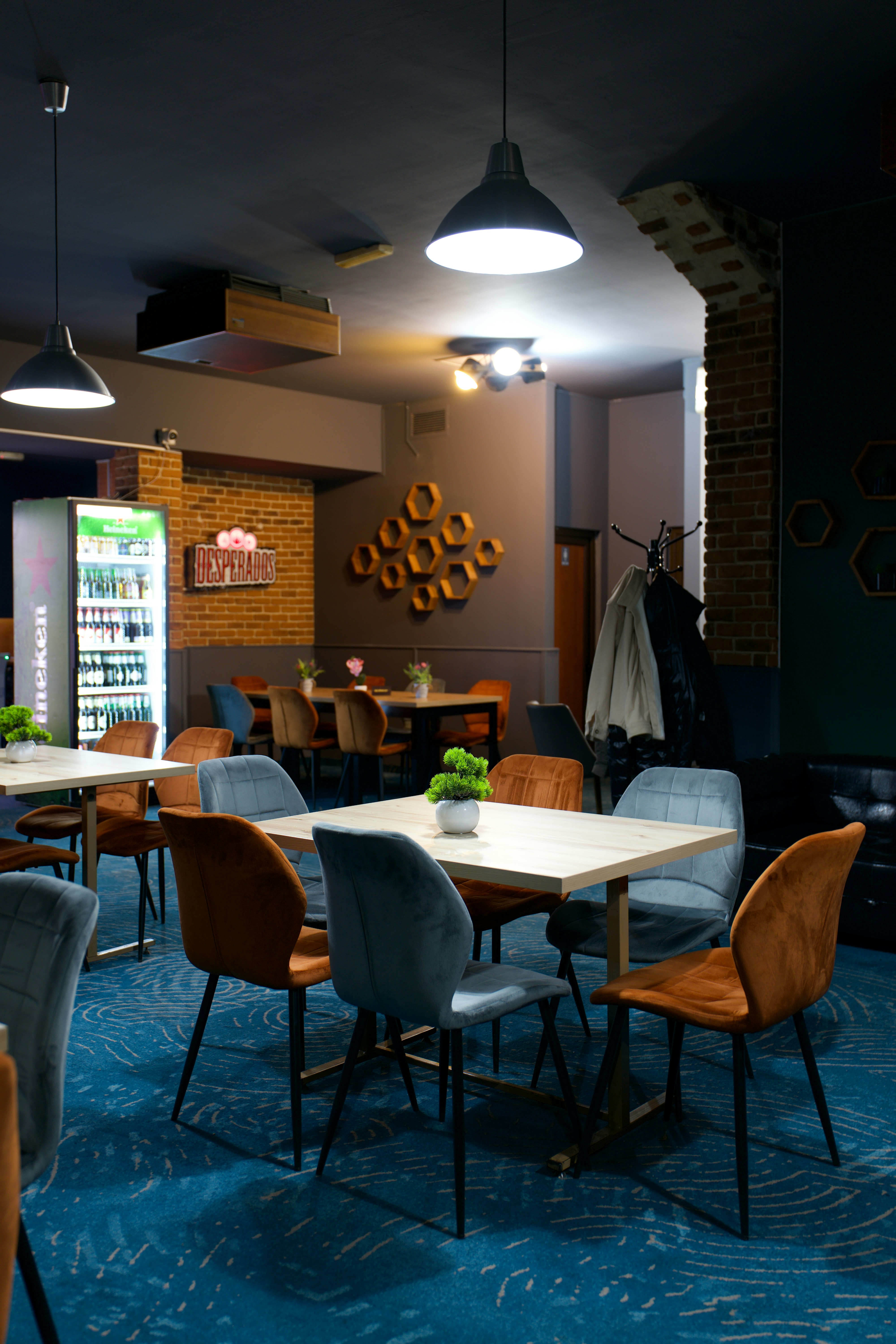 Quiet Corner: A Café Lounge Scene Under Soft Industrial Light
