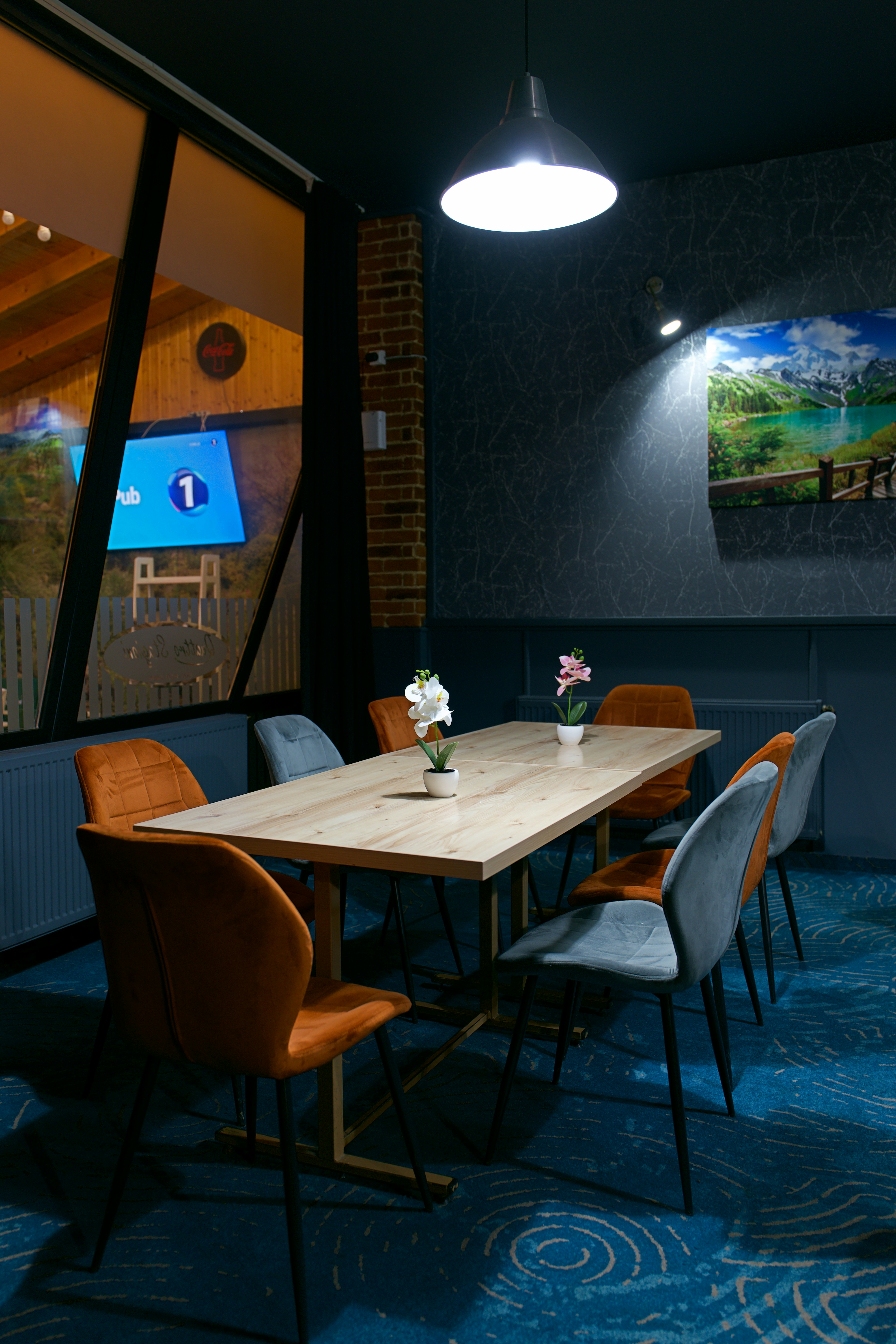 Cozy dining nook under a hanging glow in a modern café