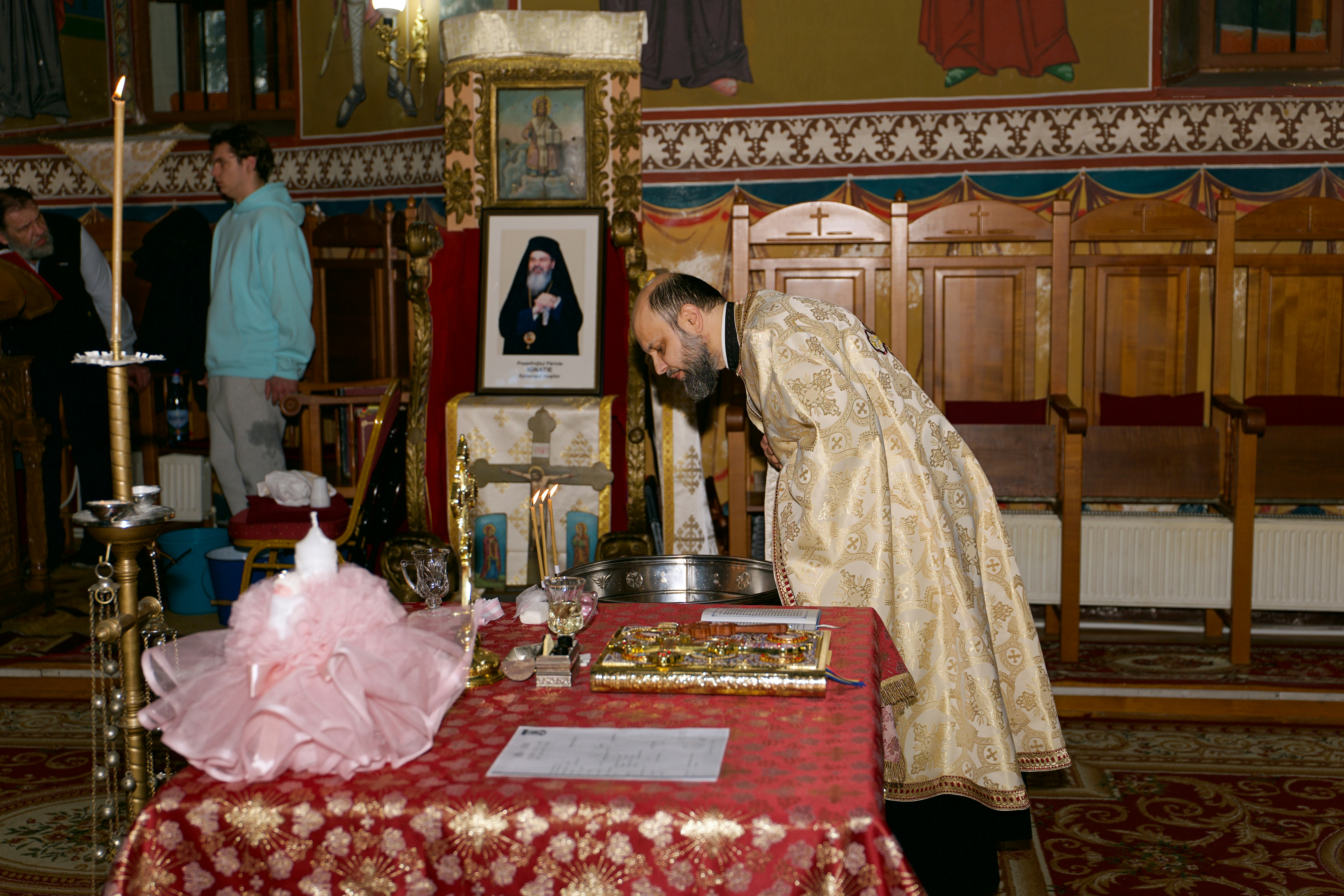 Priest at a golden table: a solemn ritual in an ornate hall