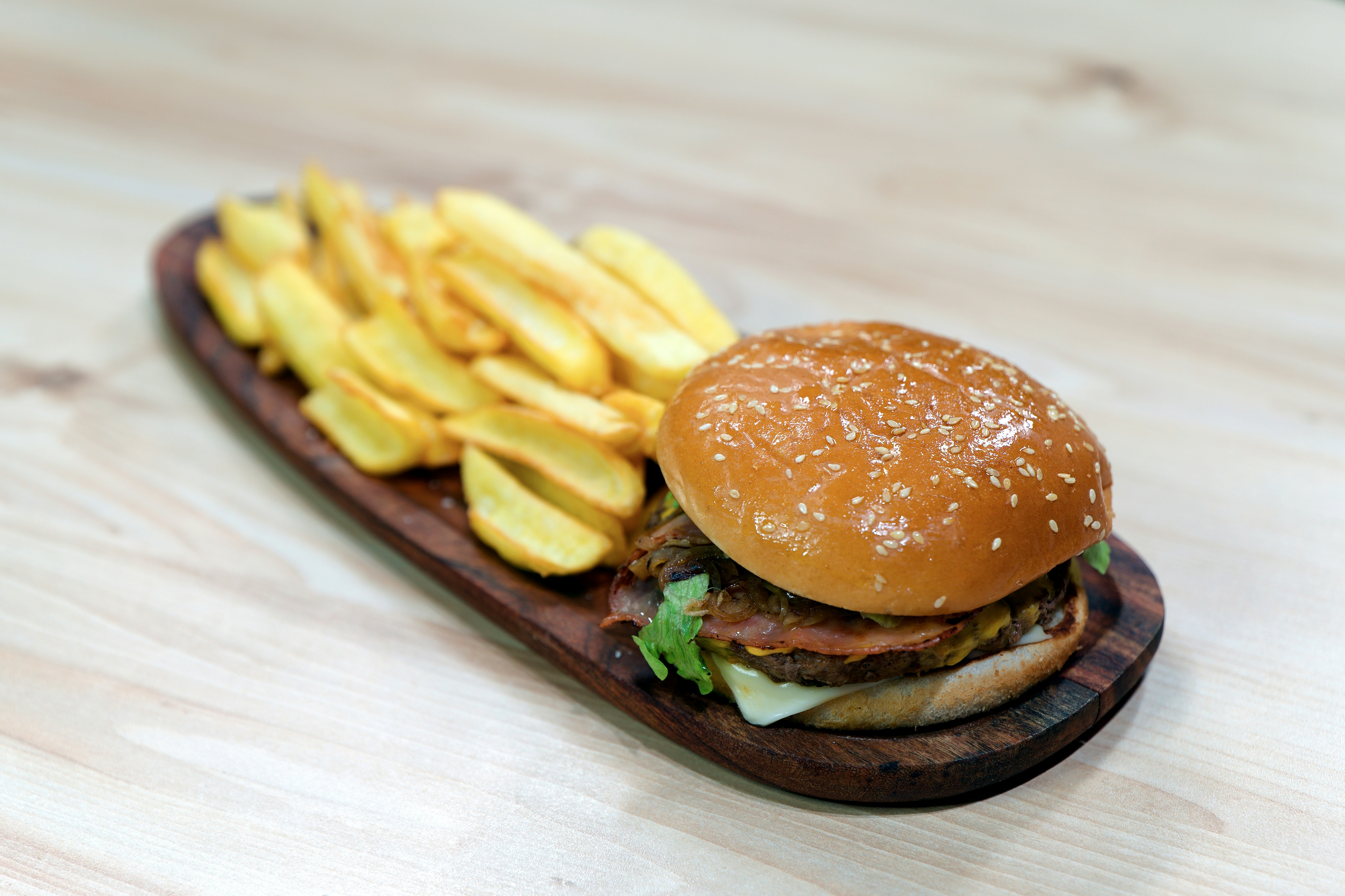 Charred Patty Spotlight on a Rustic Burger Plate