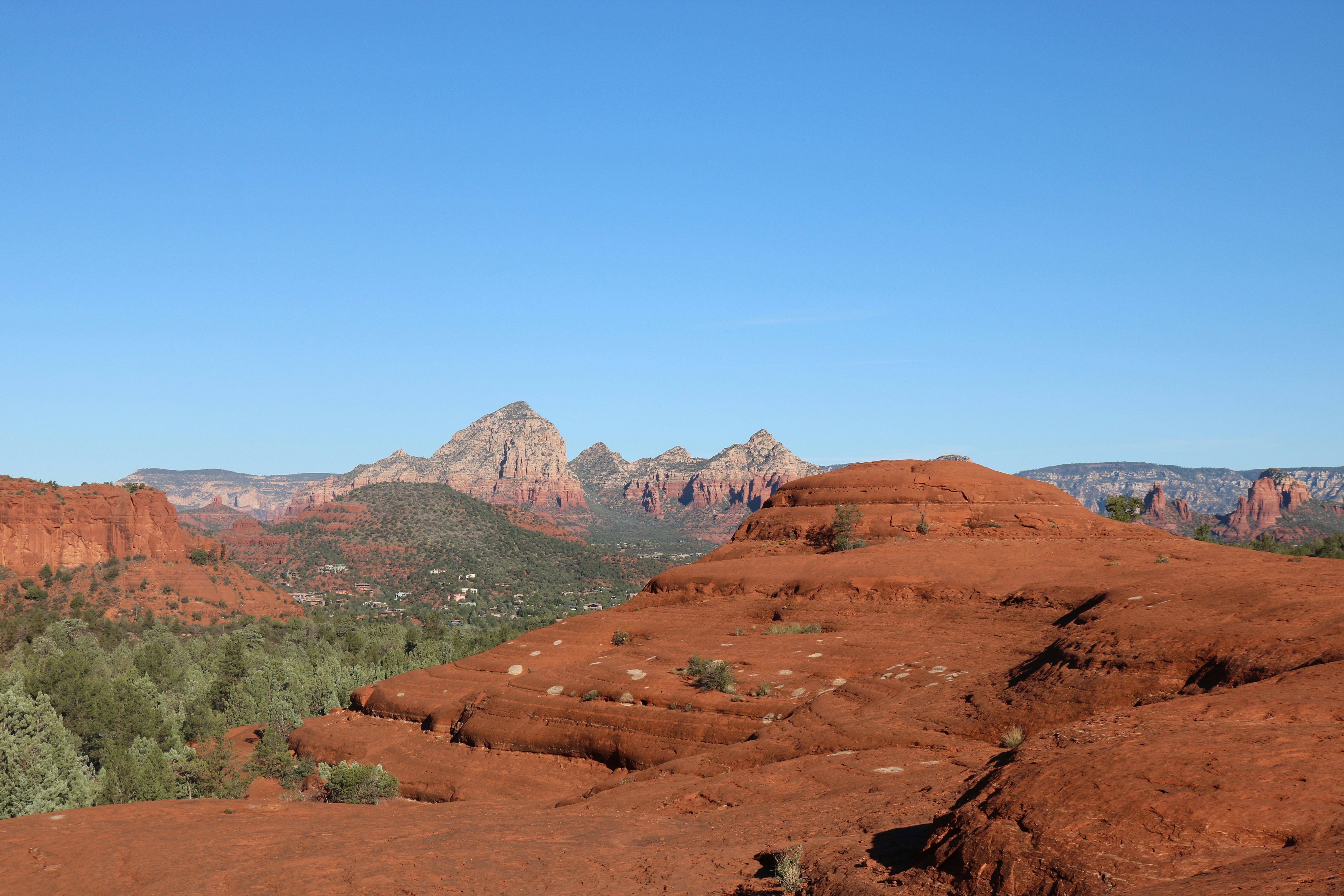 Red Rock Horizons: Fiery Plateaus Under a Clear Sky