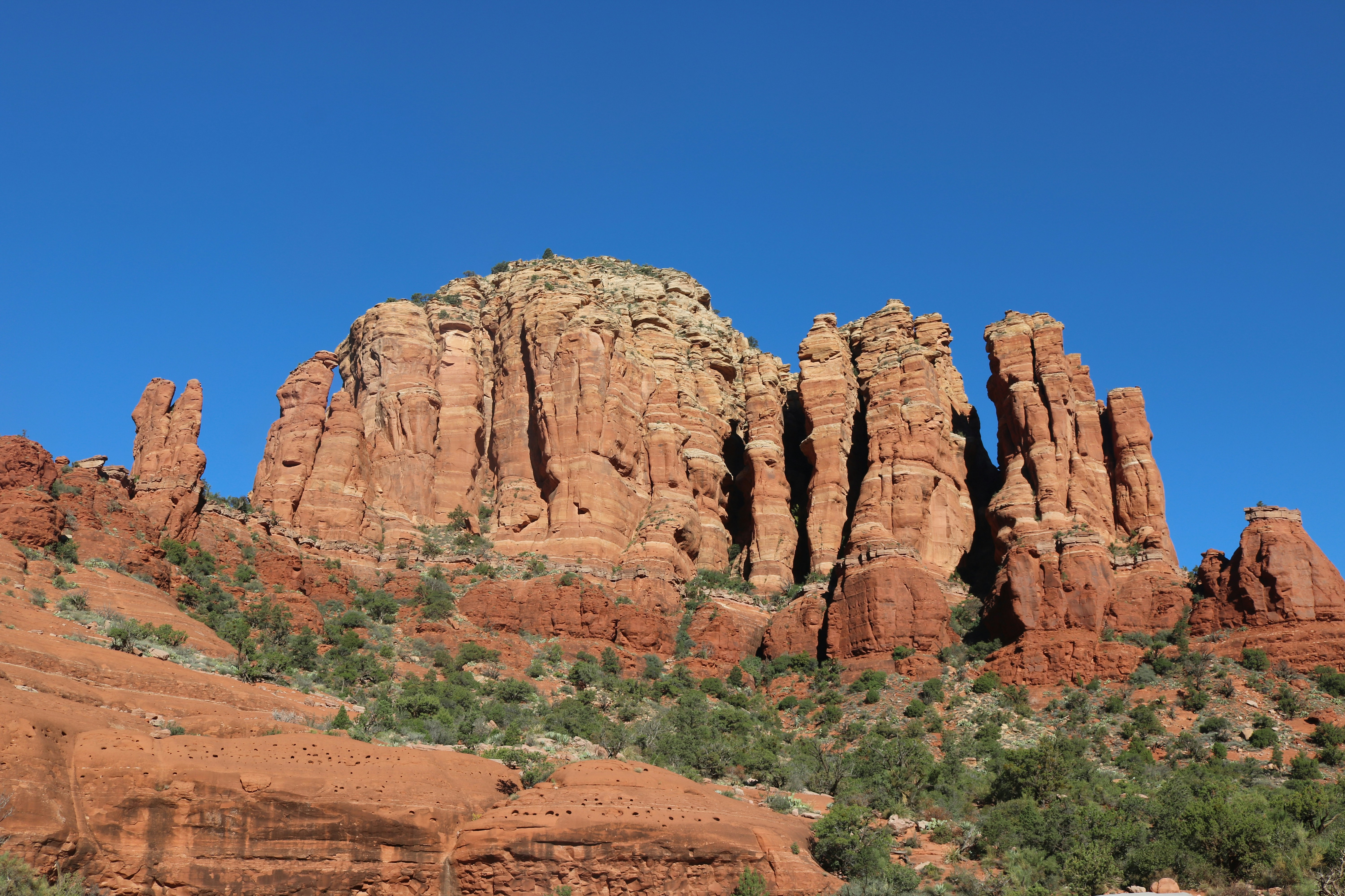 Red Stone Sentinels Under a Empty Blue Dome