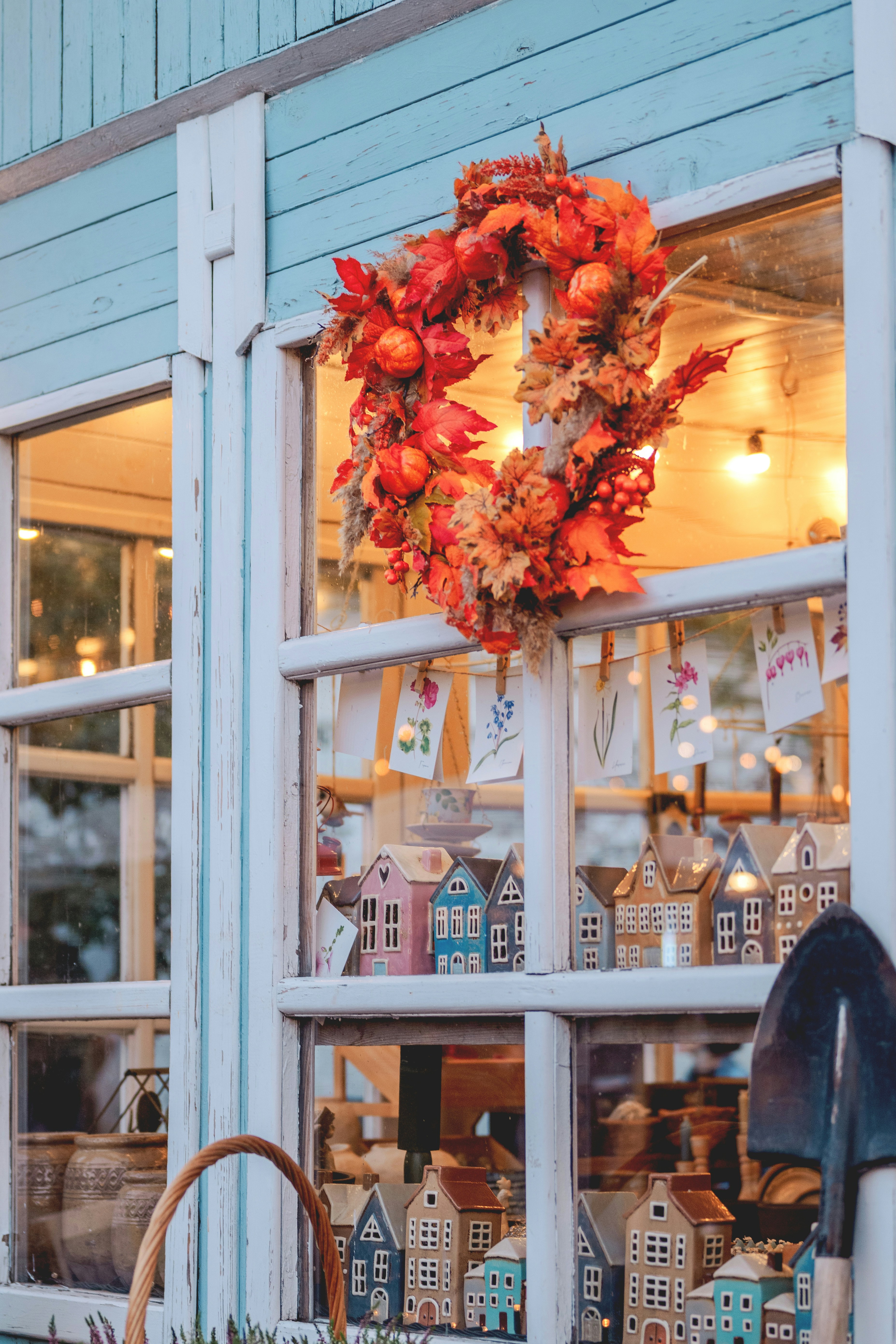 Autumn Wreath Framing a Cozy Shop Window