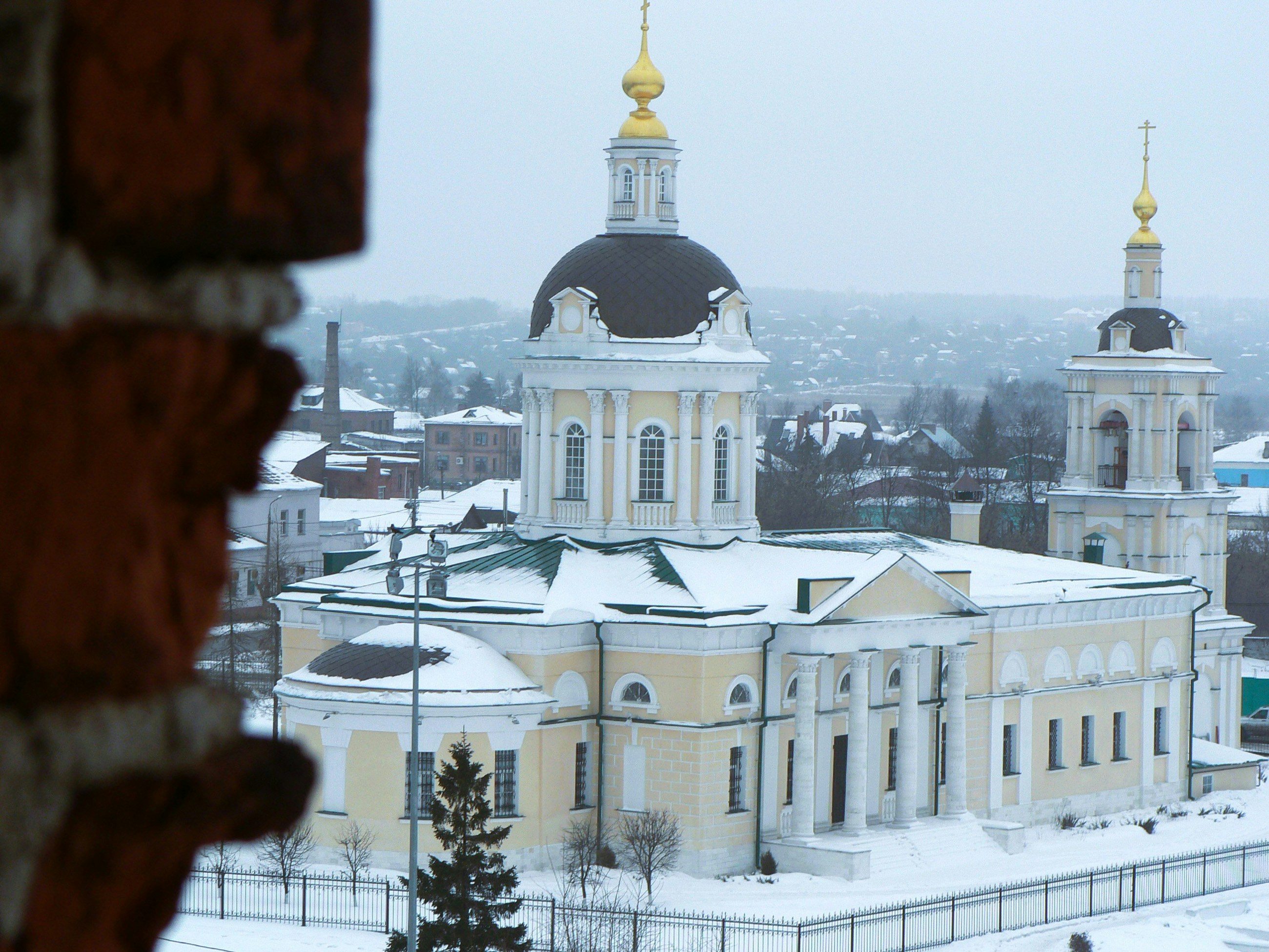 Snow-Capped Cathedral Complex Under Pale Winter Sky