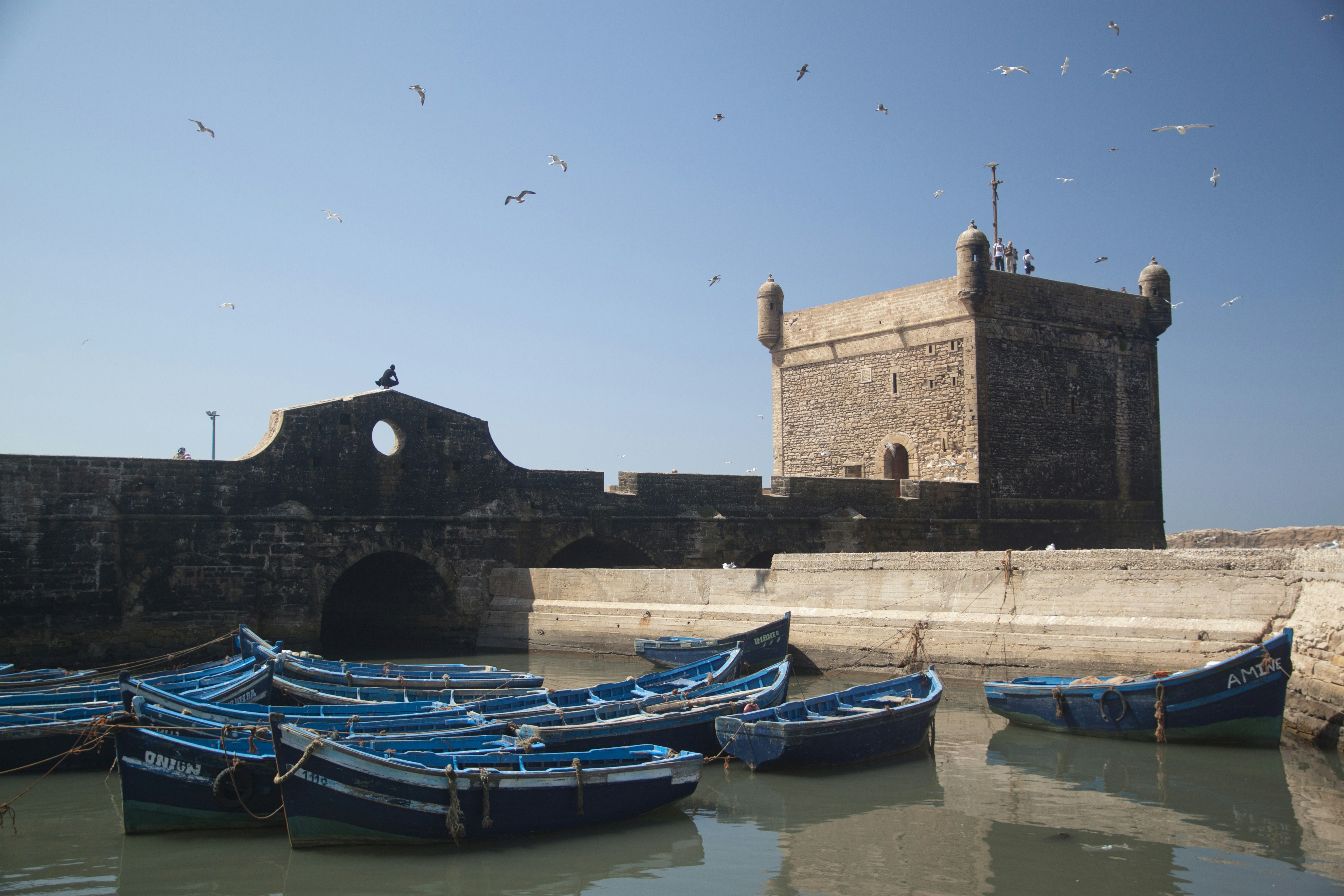 Harbor Bastion and Blue Boats at Dusk
