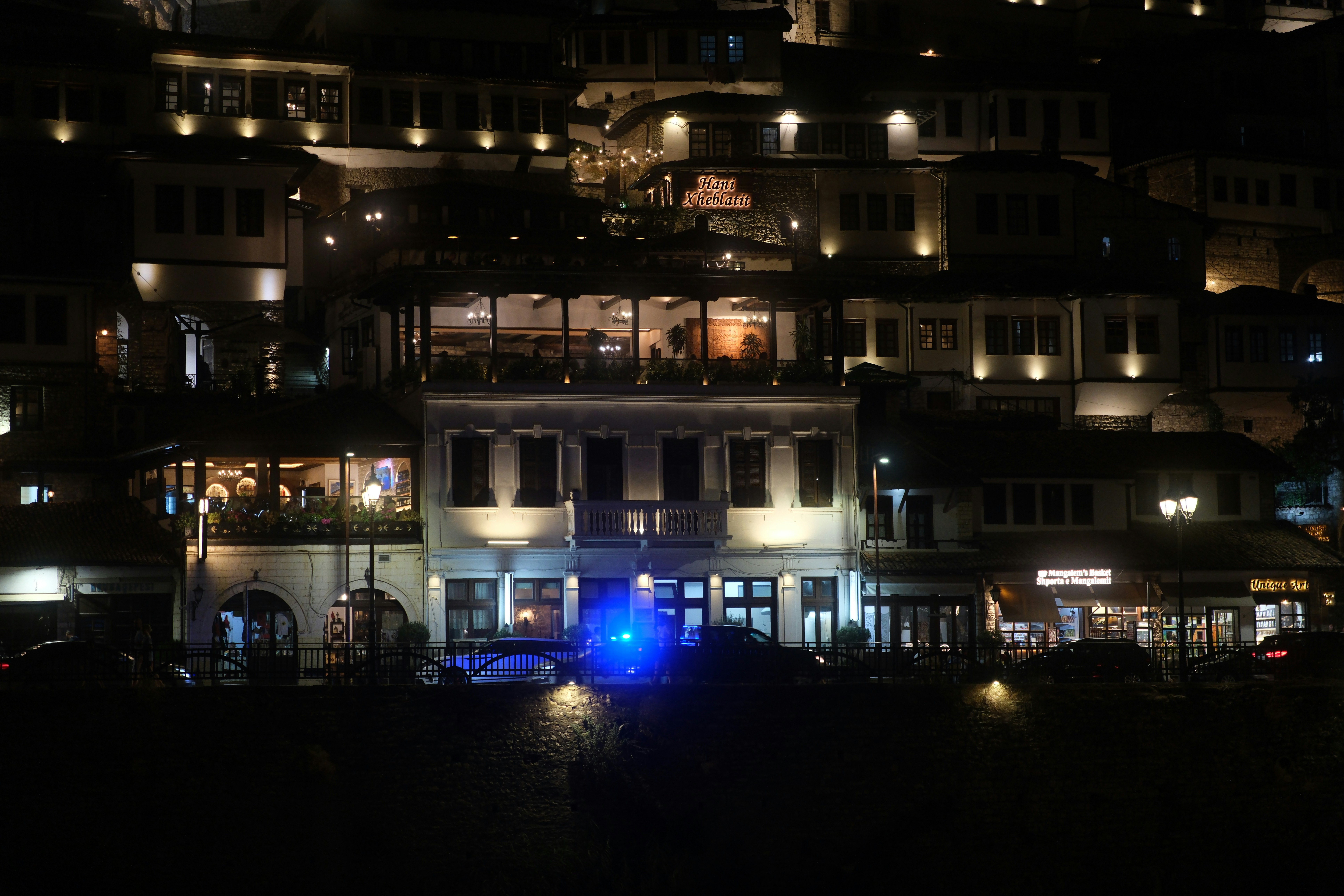 Nightfront at the Harbor: Illuminated Facades and a Blue Beacon