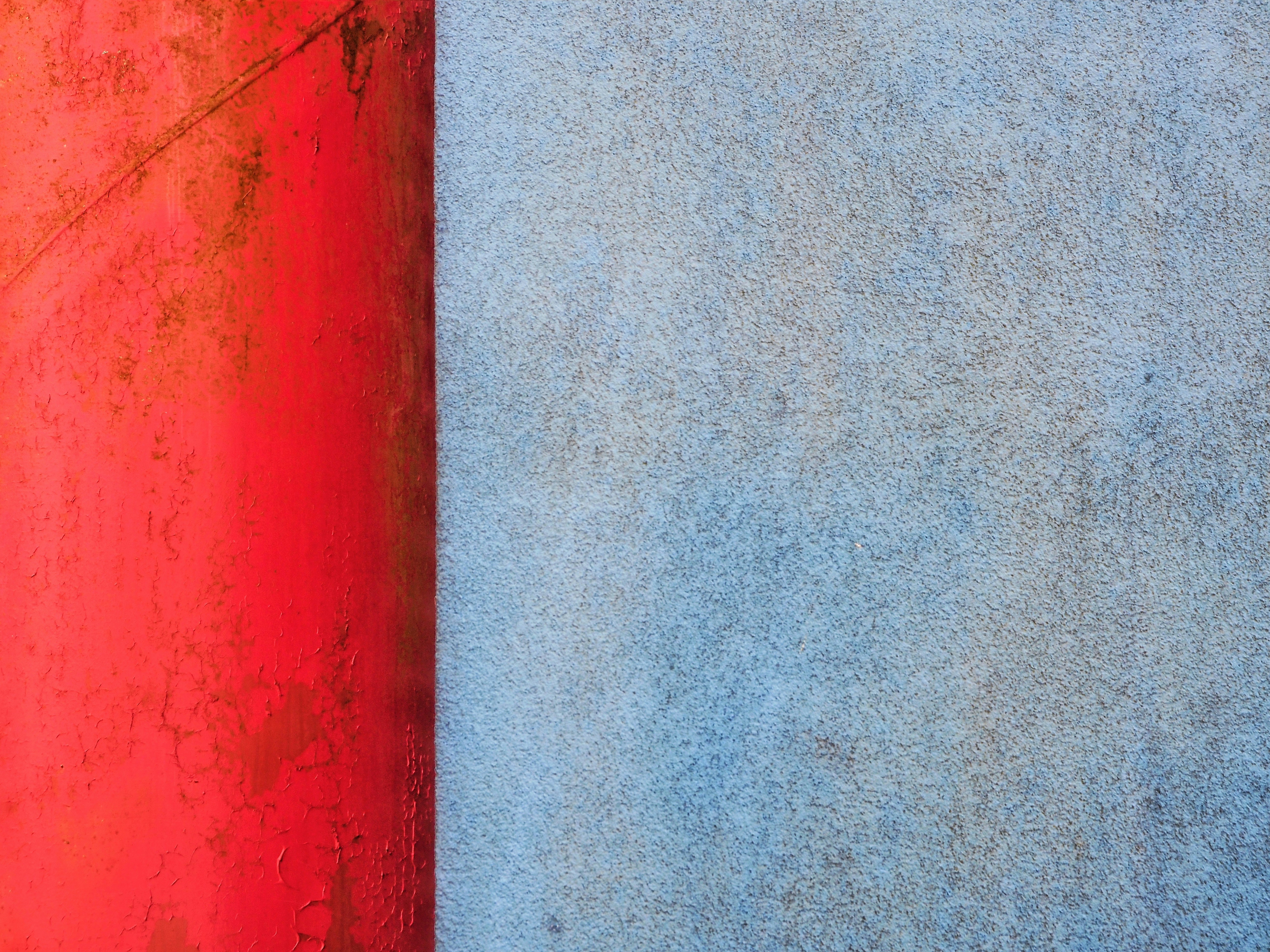 Red Column Meets Blue Wall: A Textured Moment in Color Block