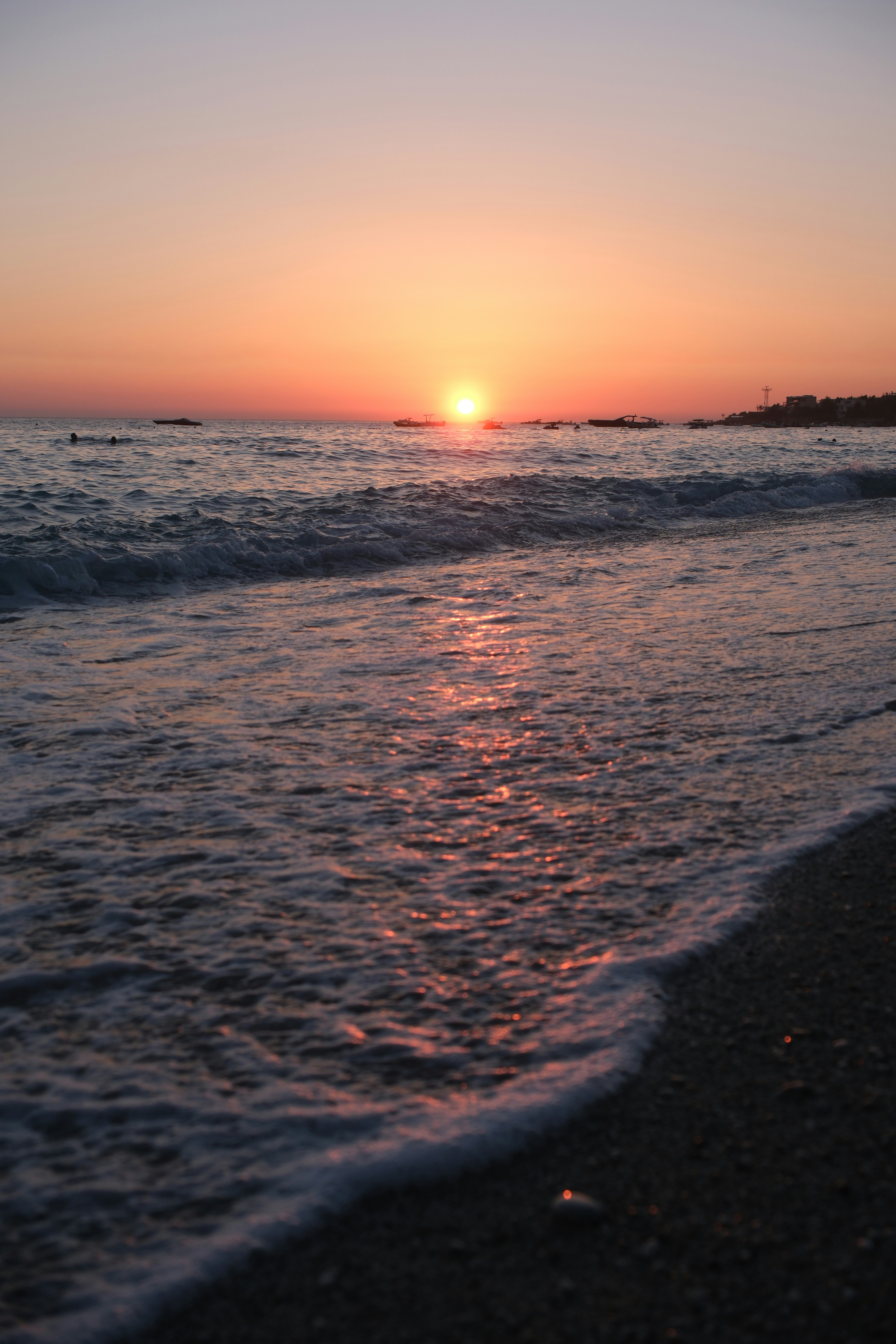 Dawn on the Quiet Shore: Sunlit Promise Over Gentle Waves