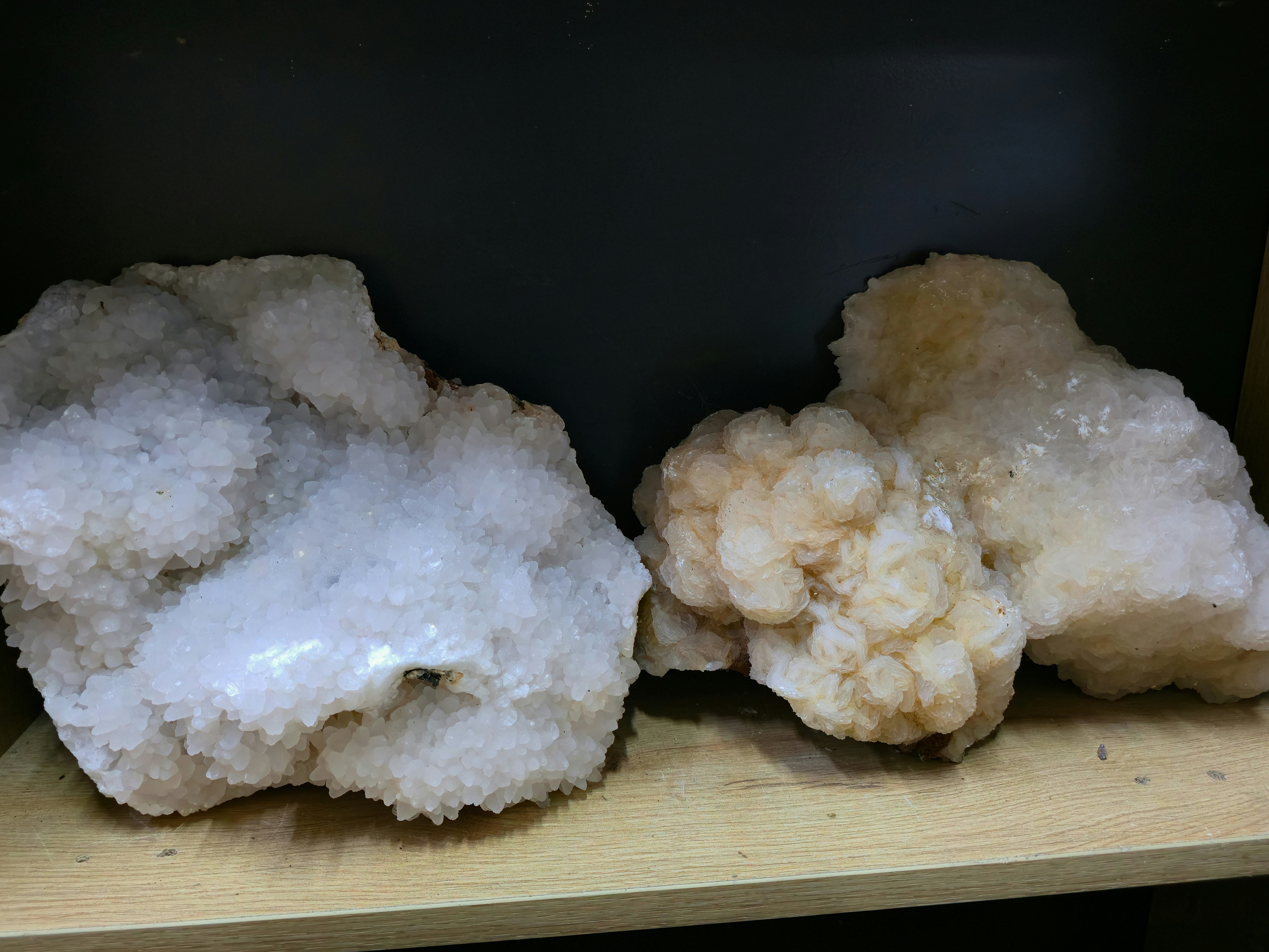 Two Celestial Clusters on a Wooden Shelf