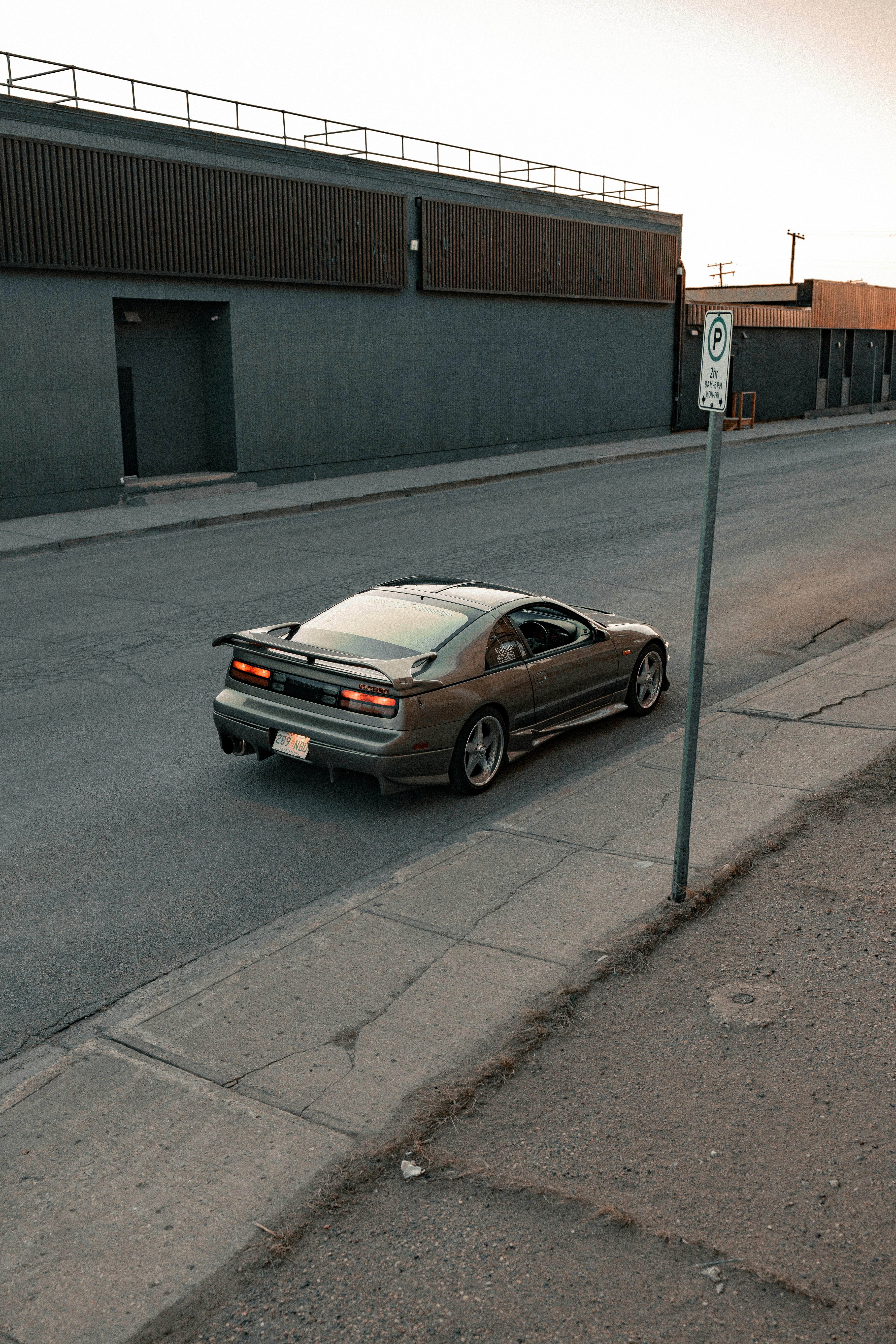 Grey Peg: A Street-Tucked Ferrari Under Urban Quiet