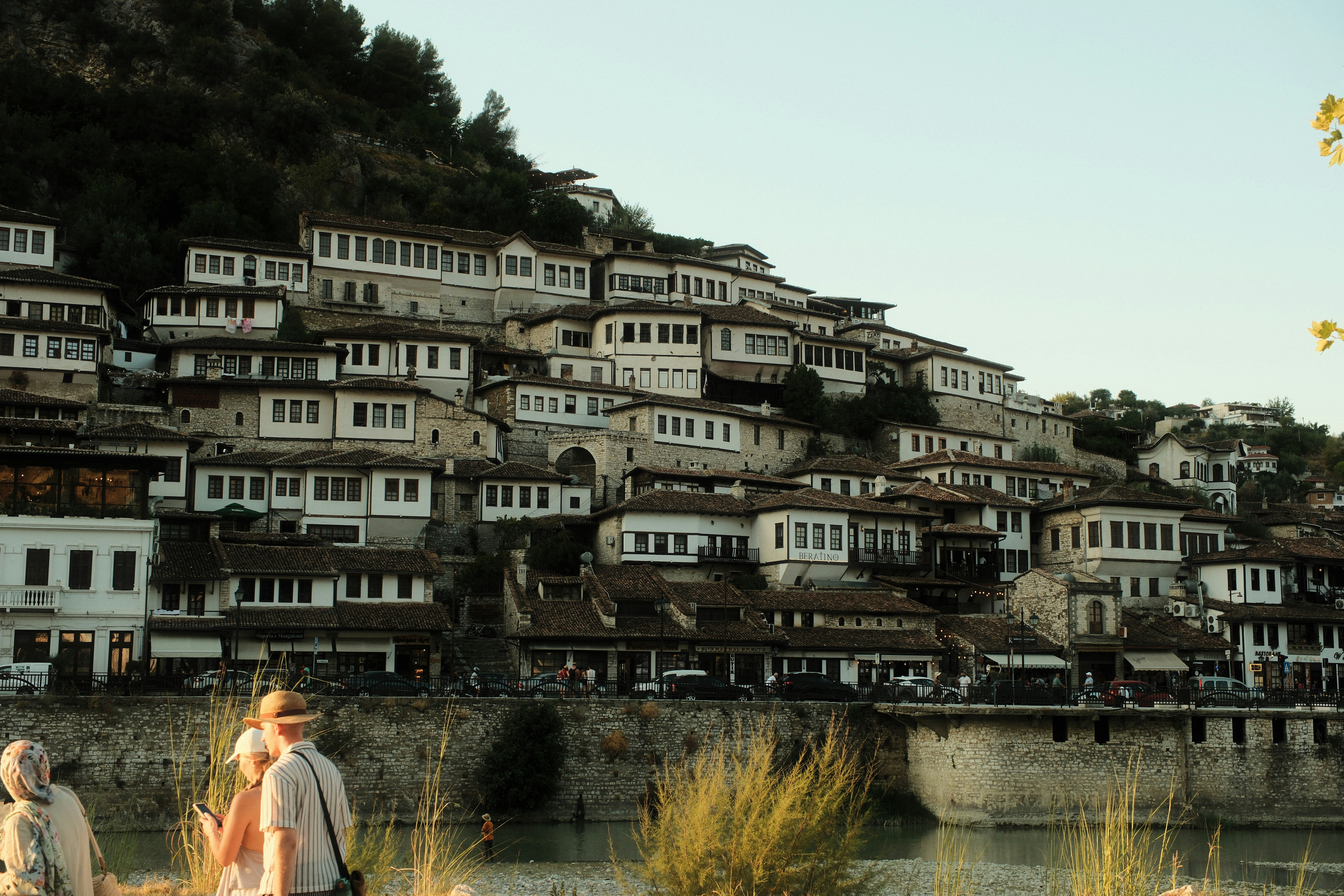 Terraced Village by the River: Whitewashed Facades on a Hillside