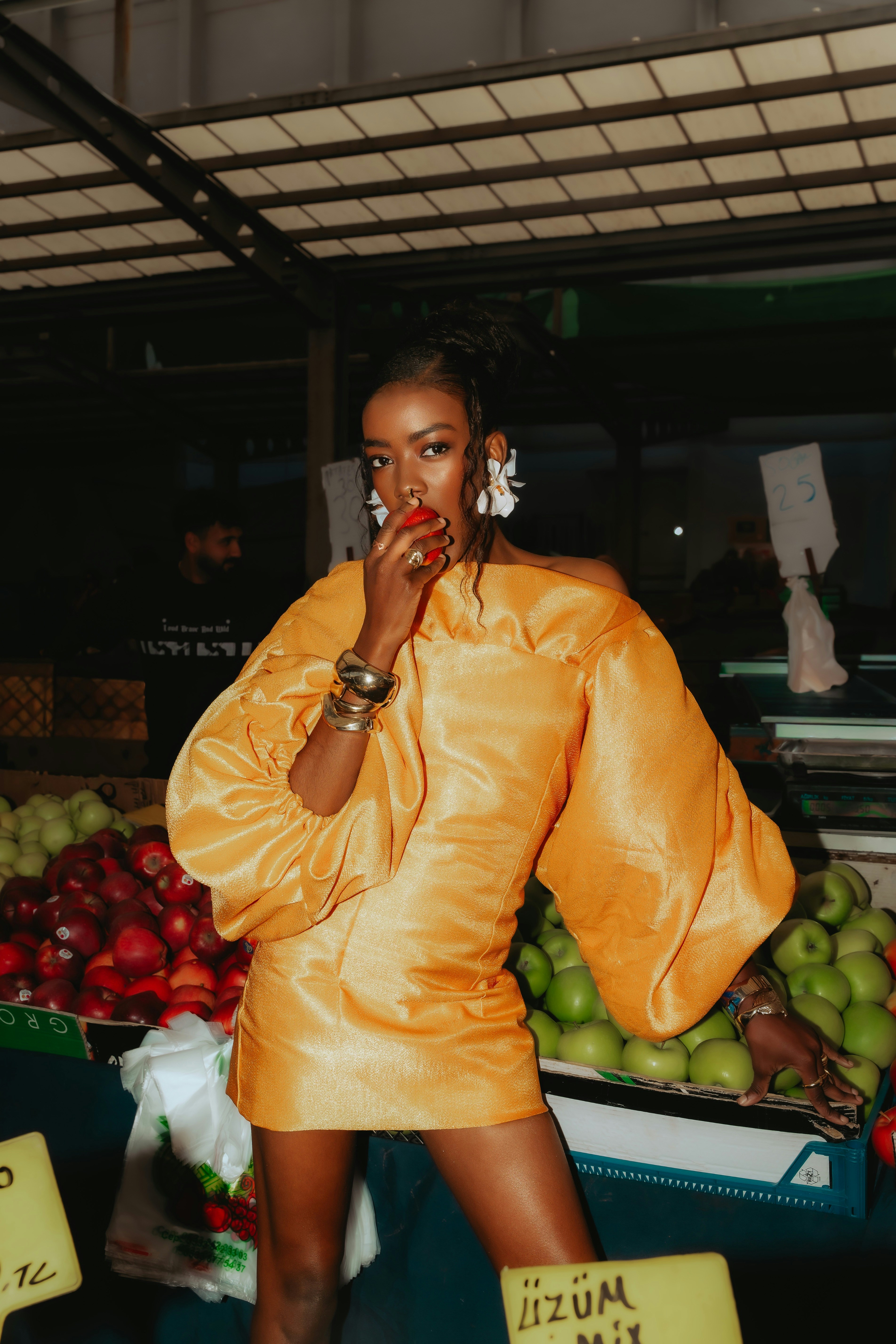 Golden Spotlight: a bold orange silhouette under market lights