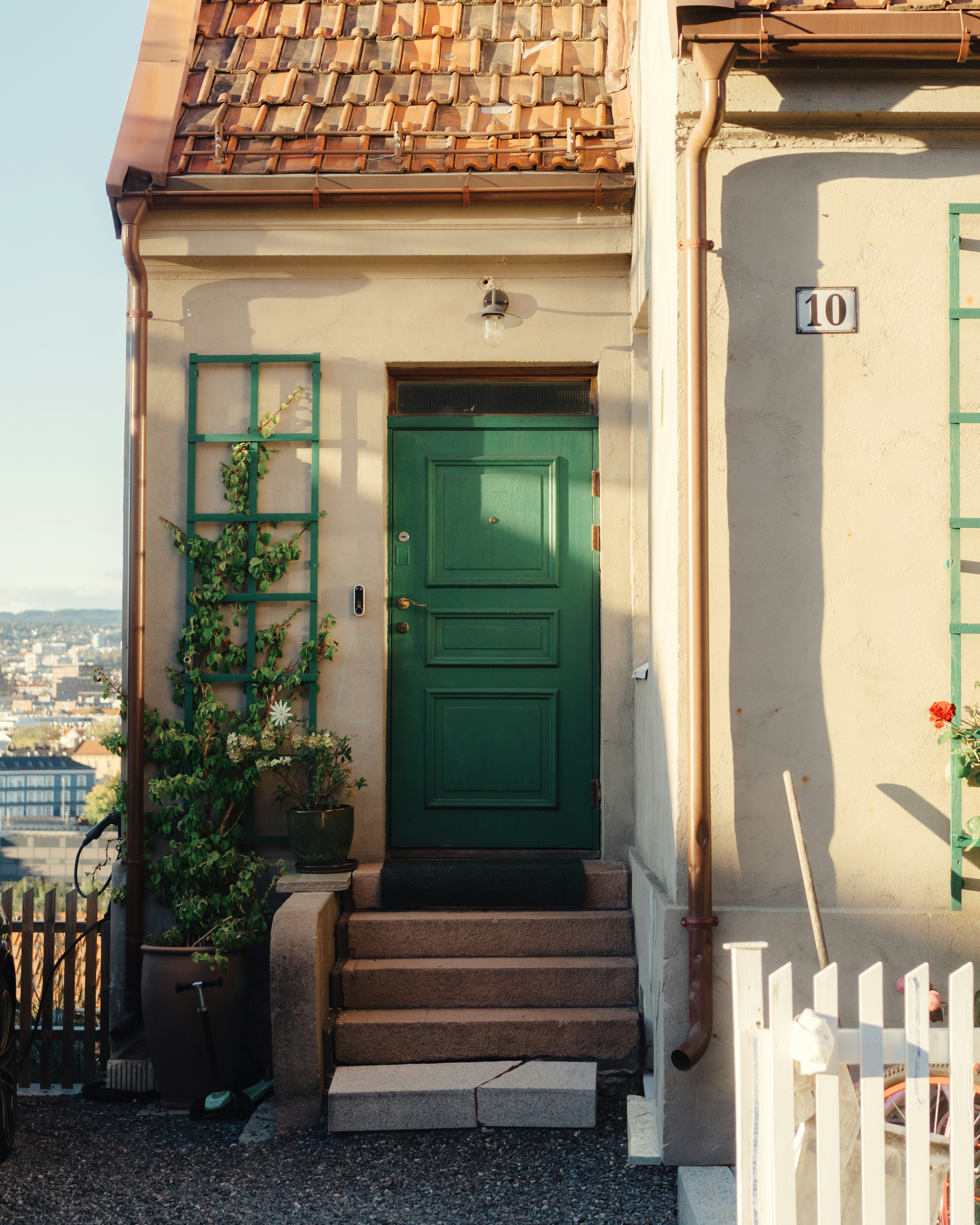 Green Doorway on a sunlit European Terrace