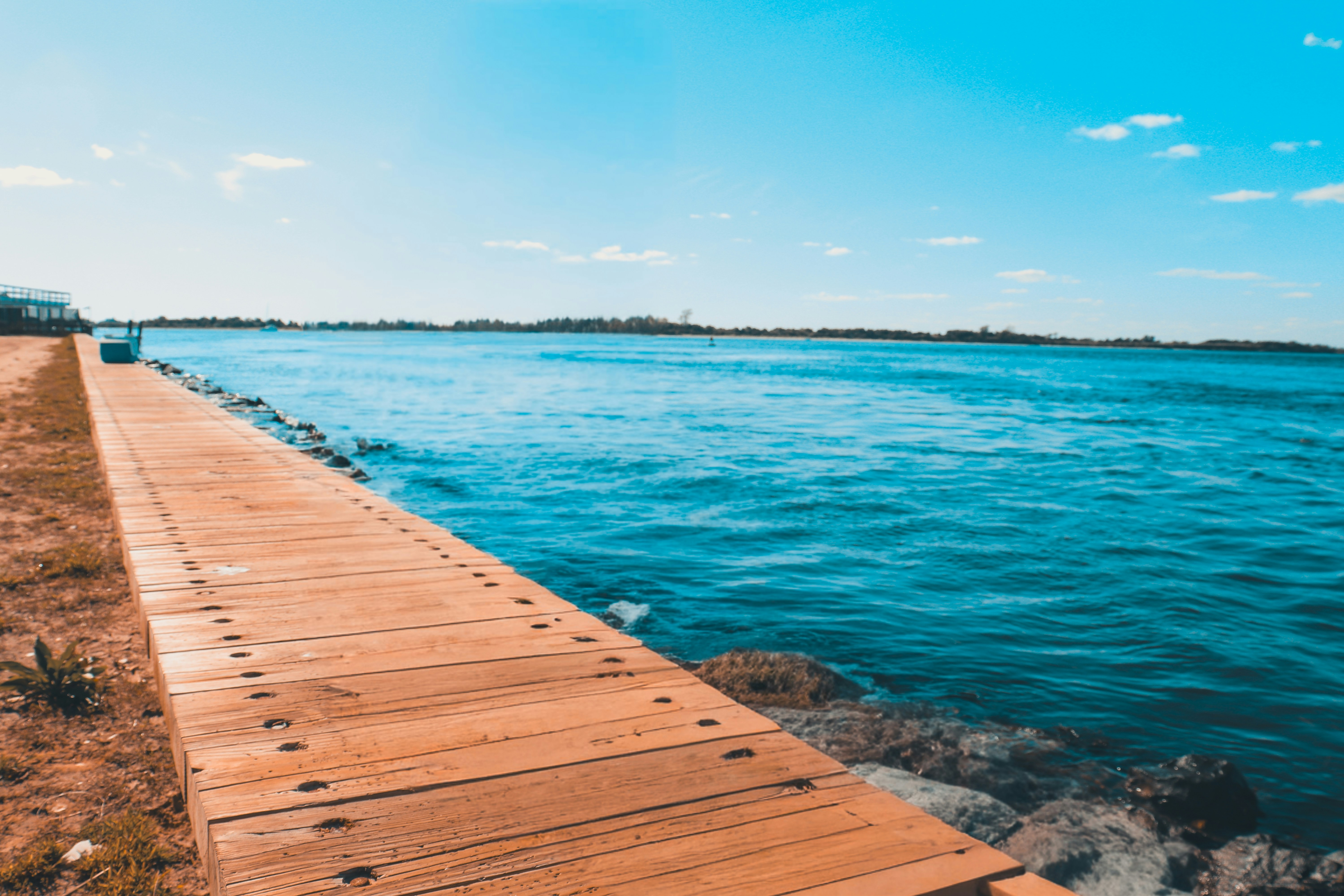 A Seaside Walkway: Wooden Planks Leading to the Open Water