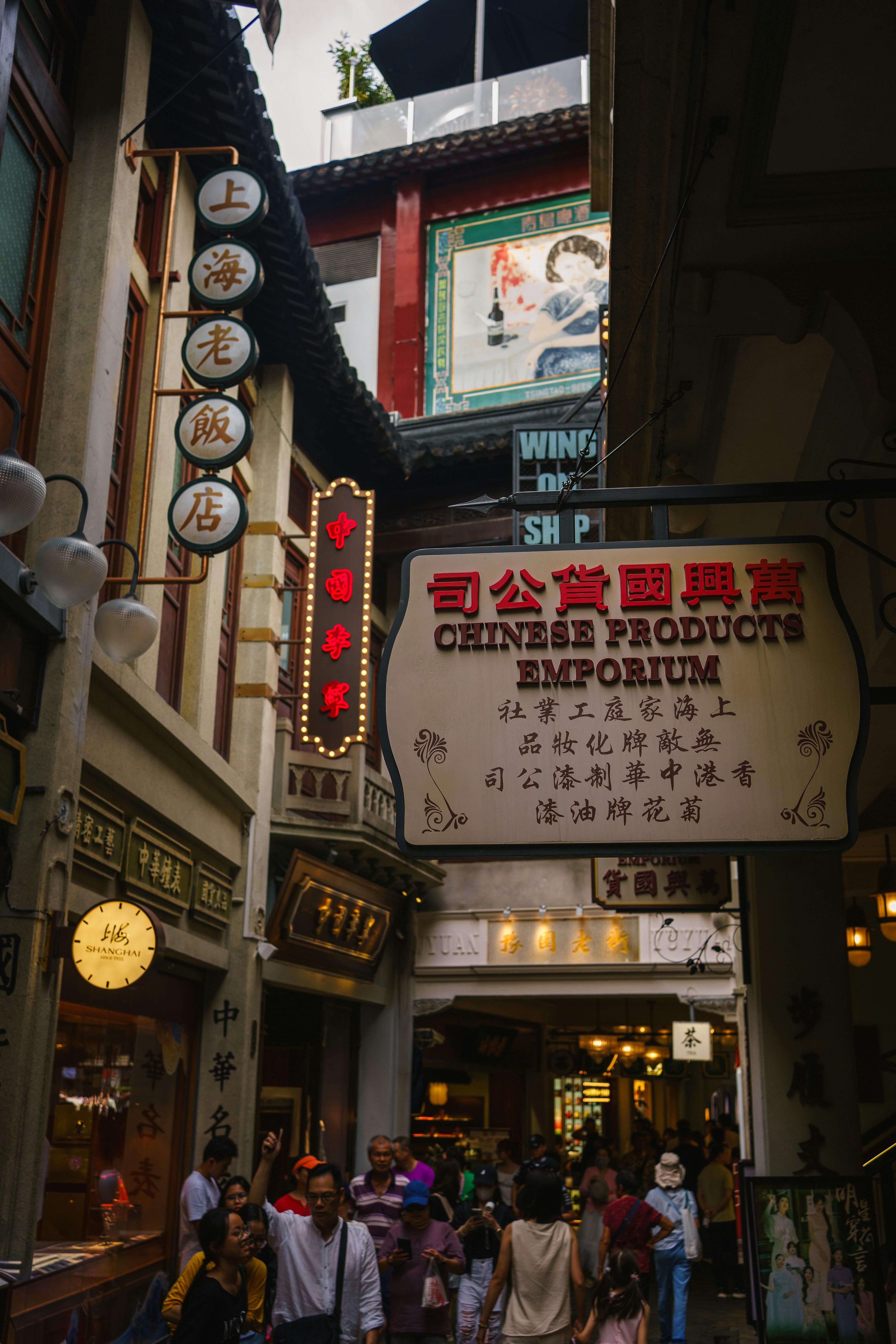 Busy Chinatown Arcade: Signs, Lanterns, and a Crowded Walkway