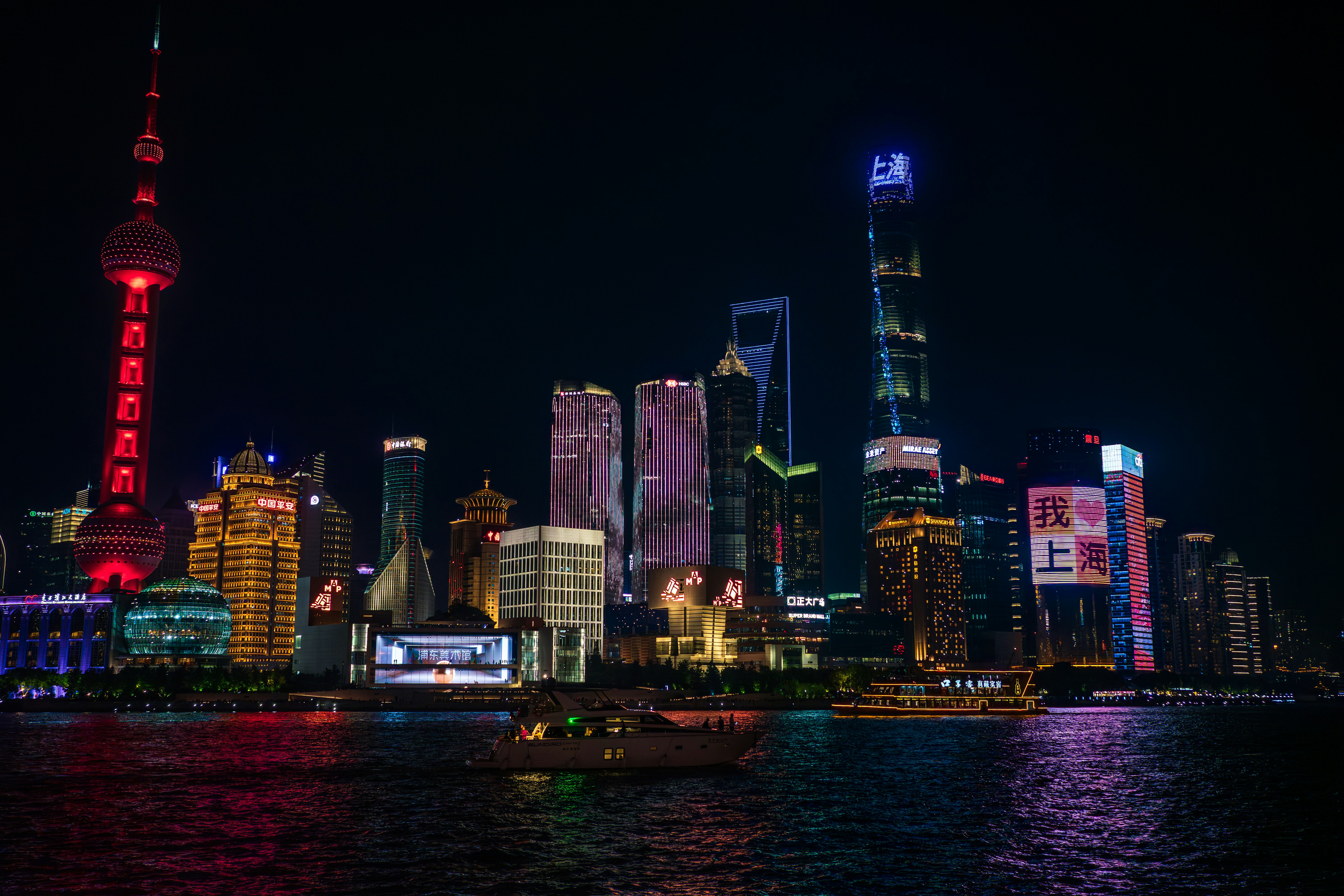 Neon Riverfront at Midnight: Shanghai Skyline Beyond the Water