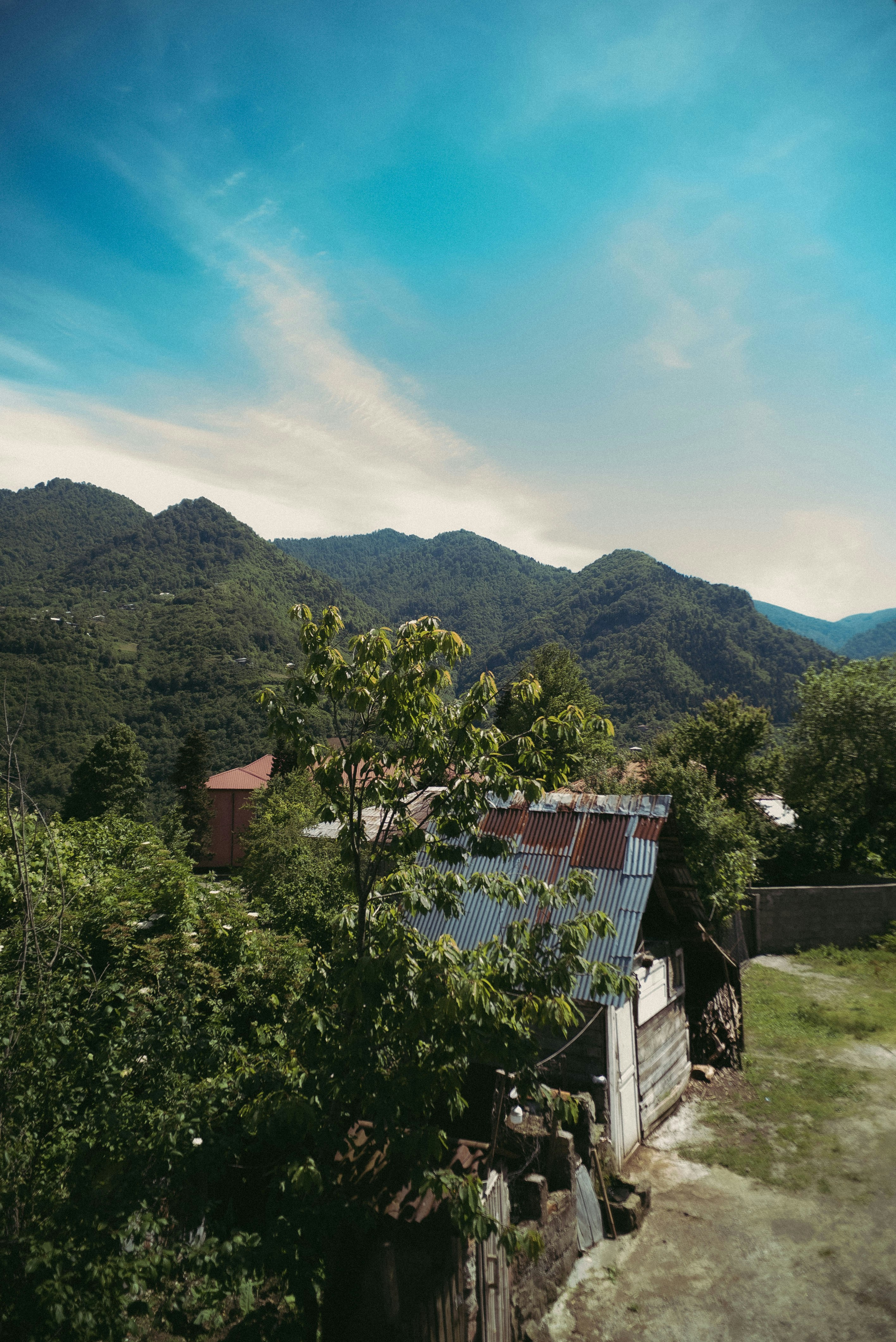 Terraced Horizon: A Quiet Valley Beneath a Blue-White Sky