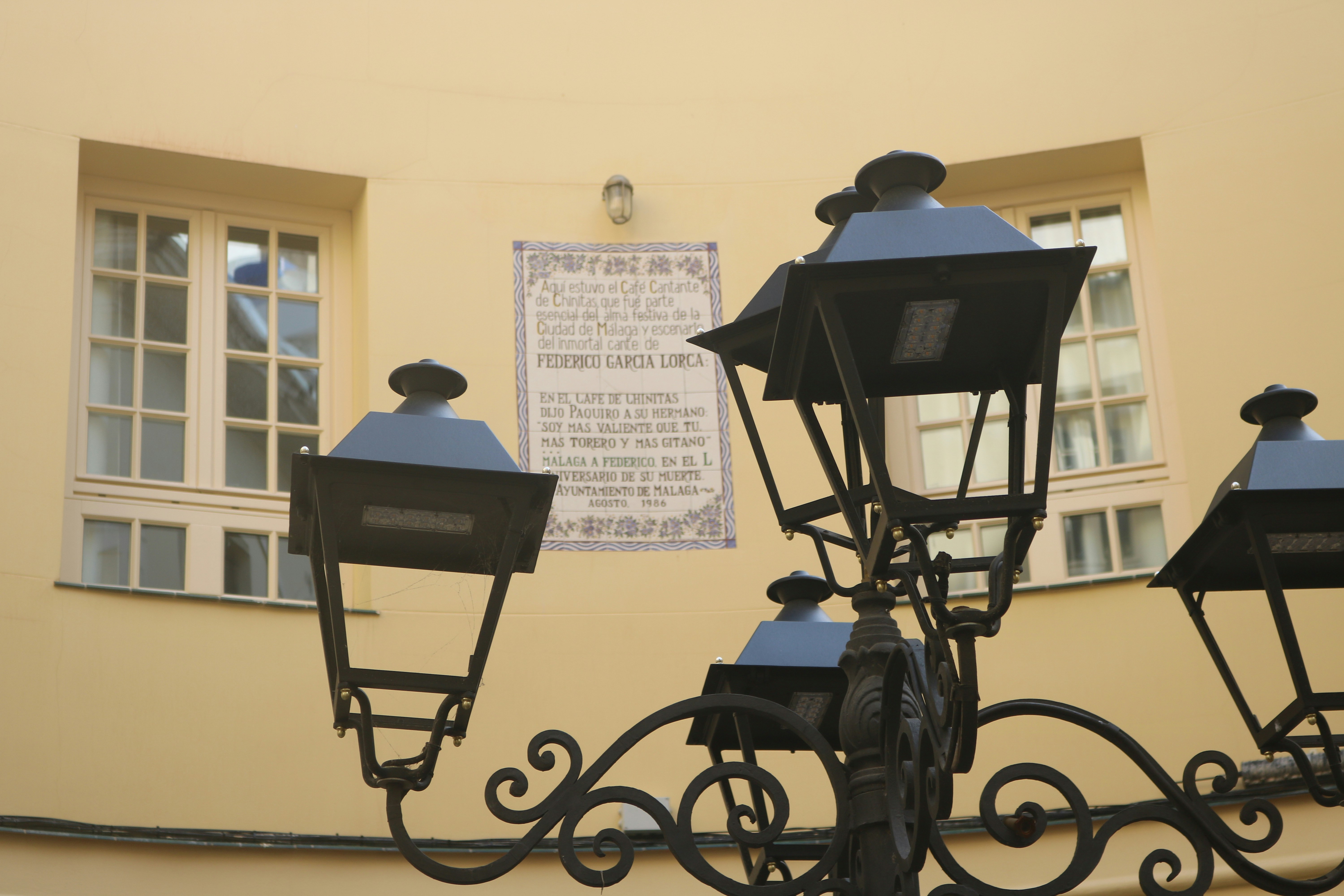 Ornate Street Lamp Portrait Within Sunlit Courtyard