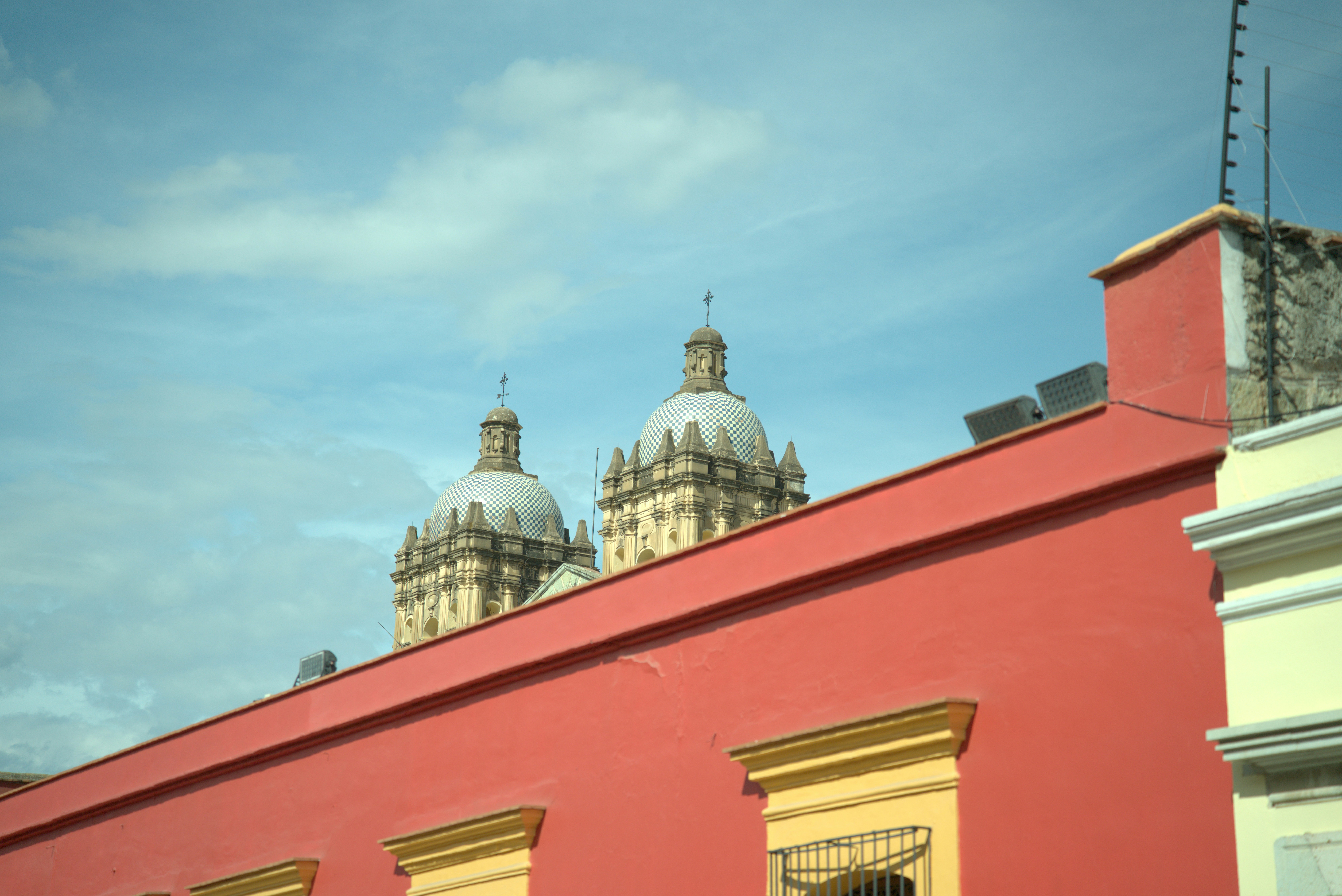 Dome-topped Skyline Above a Painted Veranda