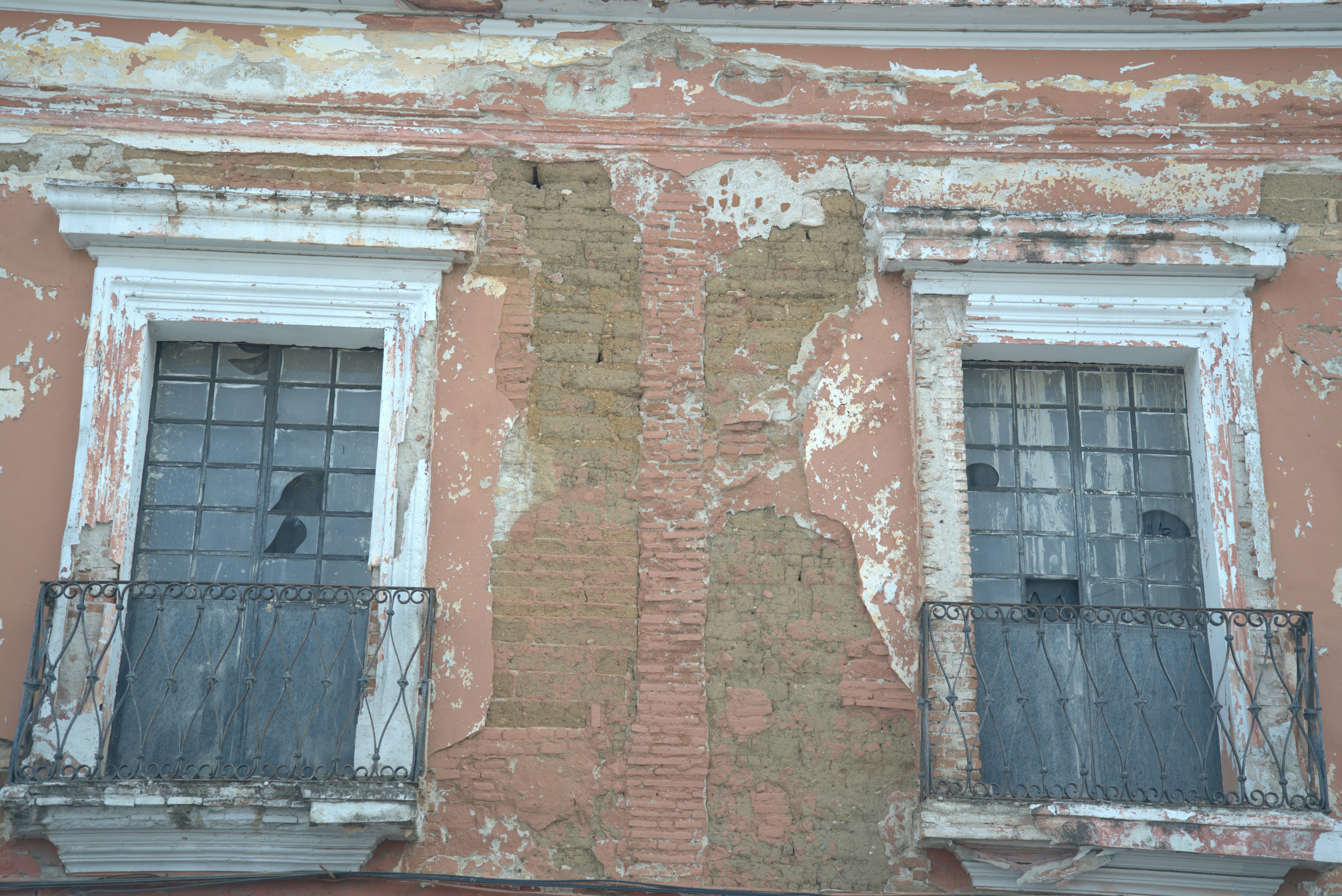 Weathered Facade with Central Patchwork Brick Pattern