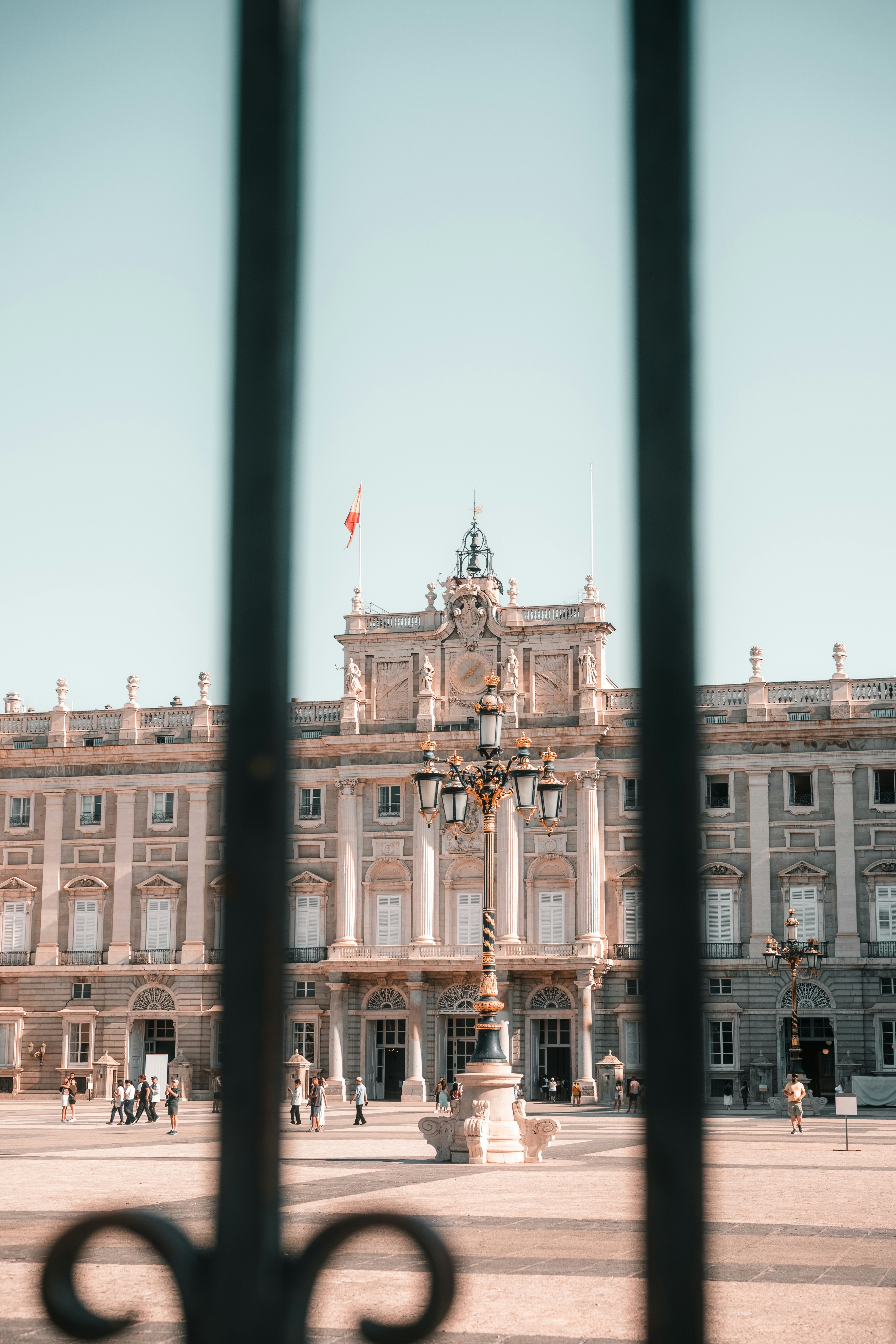 Bars of memory: the royal facade framed by iron longing