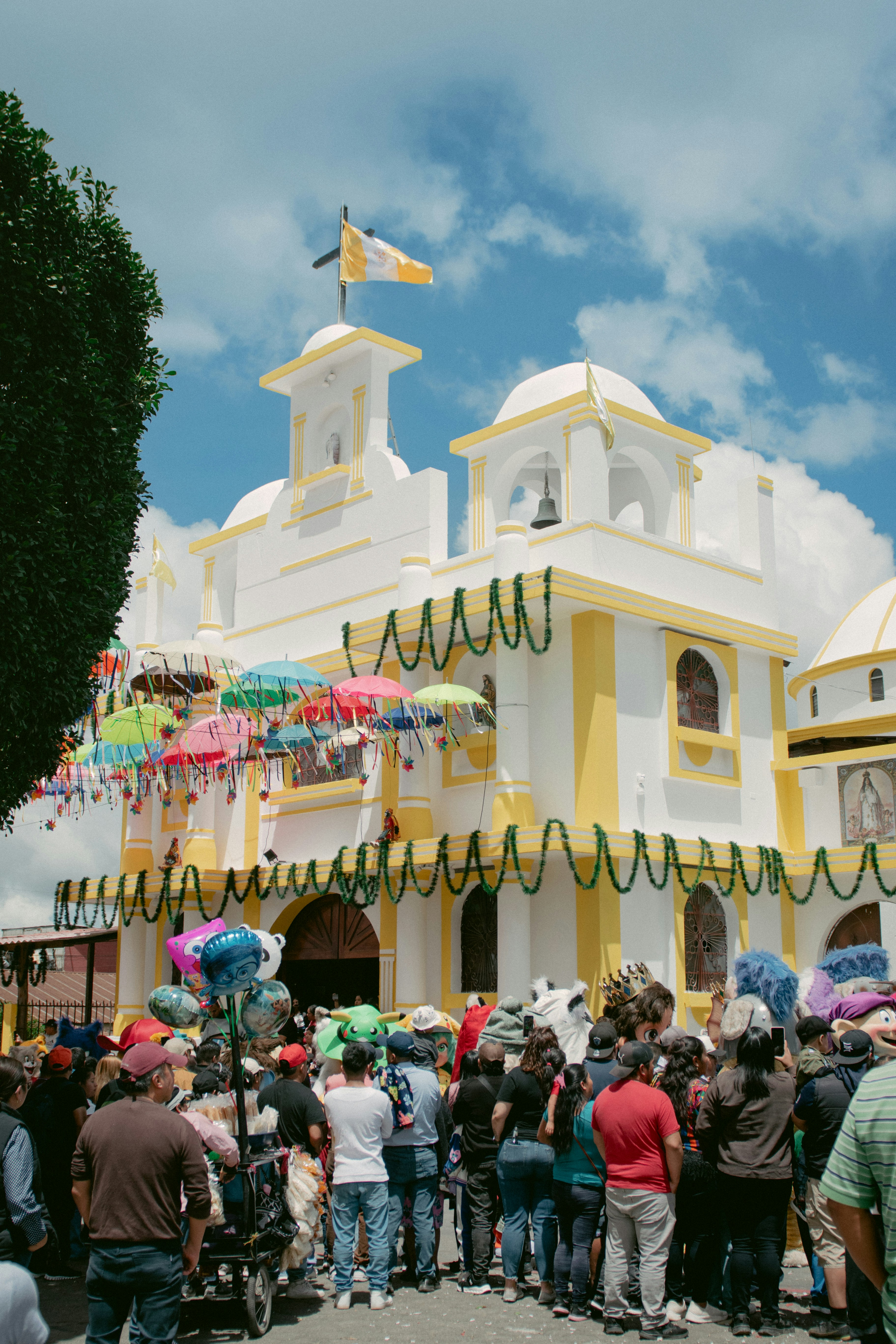 Sunlit Shrine Amid a Crowd: Carnival Colors at Golden White Temple