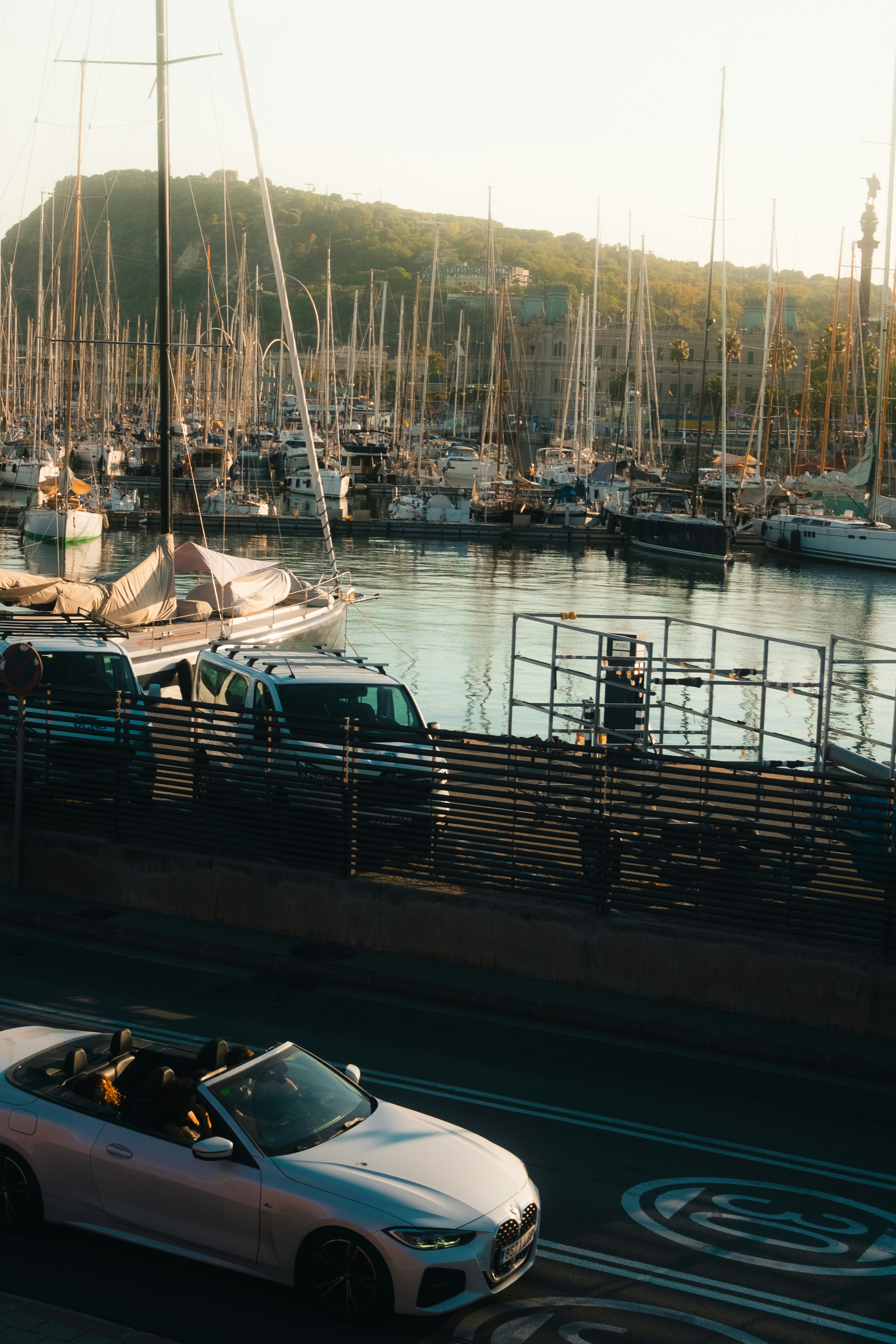 Harbor Veil: A White Convertible in the Carded Light