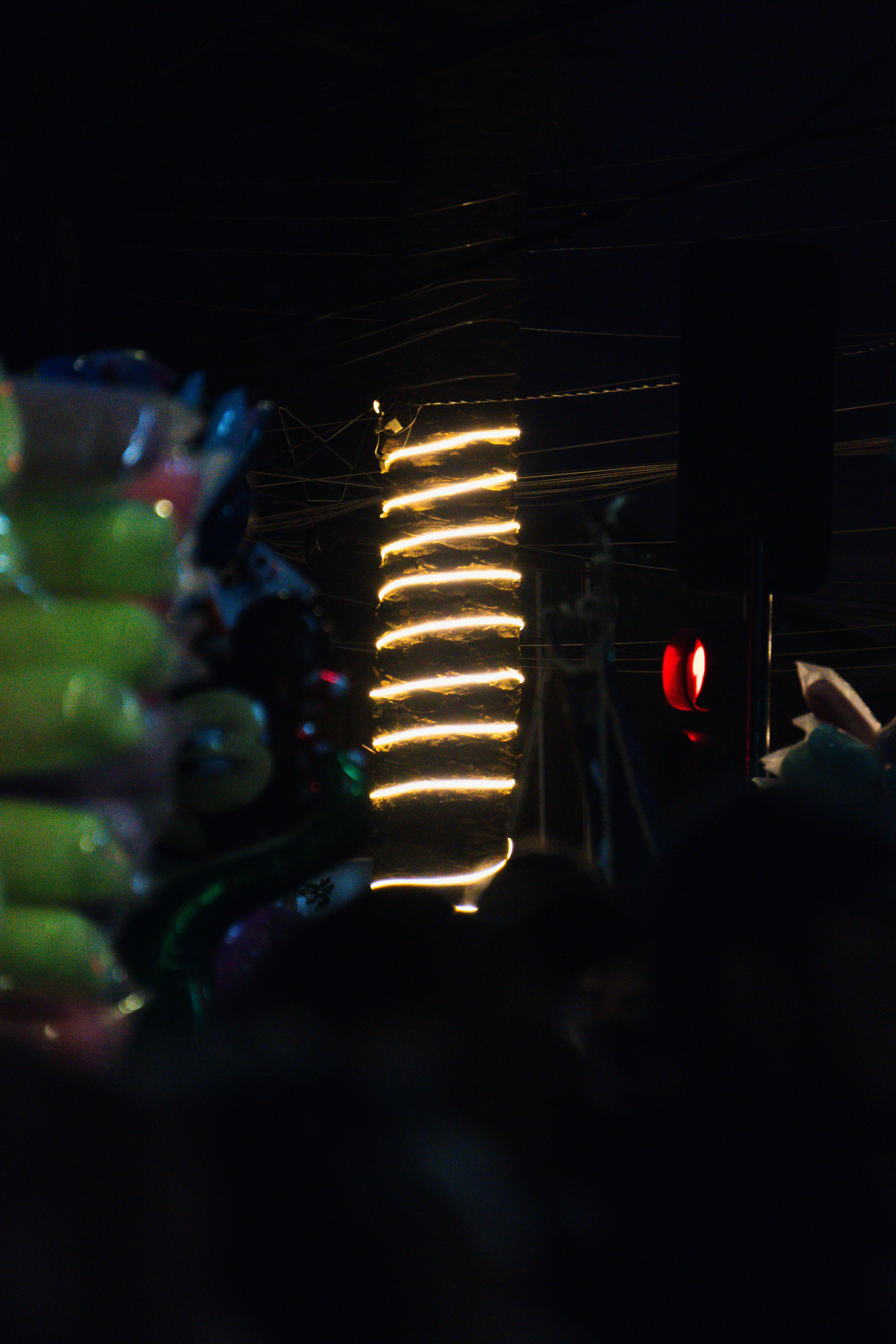 Neon Spiral in a Night Market Crowd